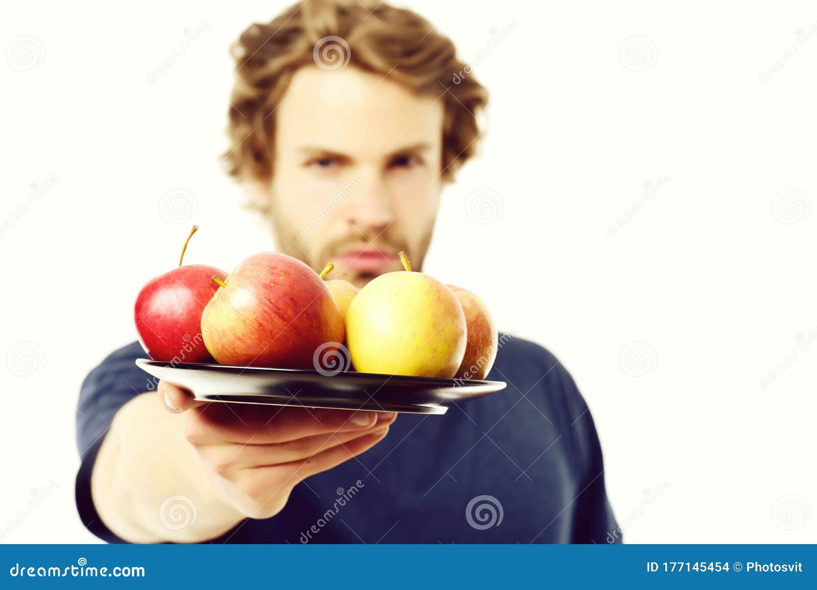 Face Expression of Strong and Confident Man Offering Apples Stock Photo ...