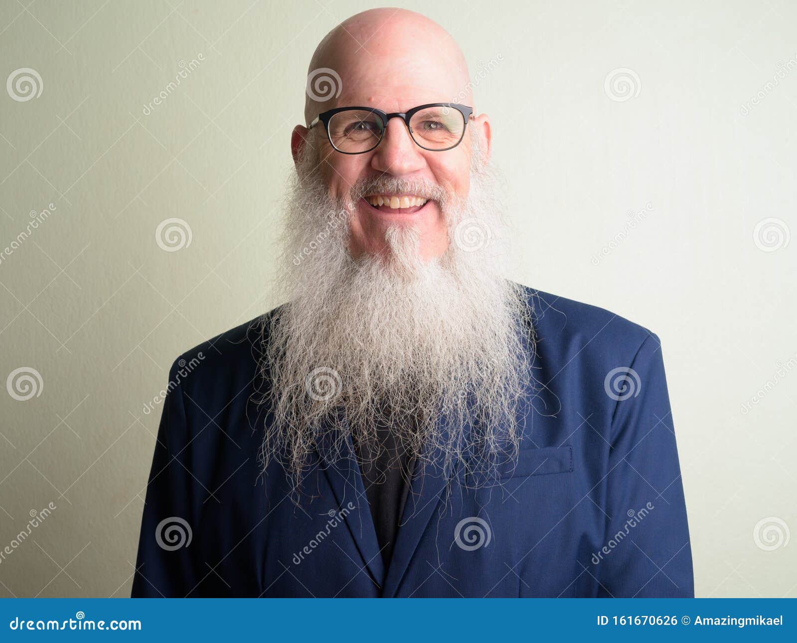 Face Of Happy Mature Bearded Bald Businessman In Suit Smiling Stock