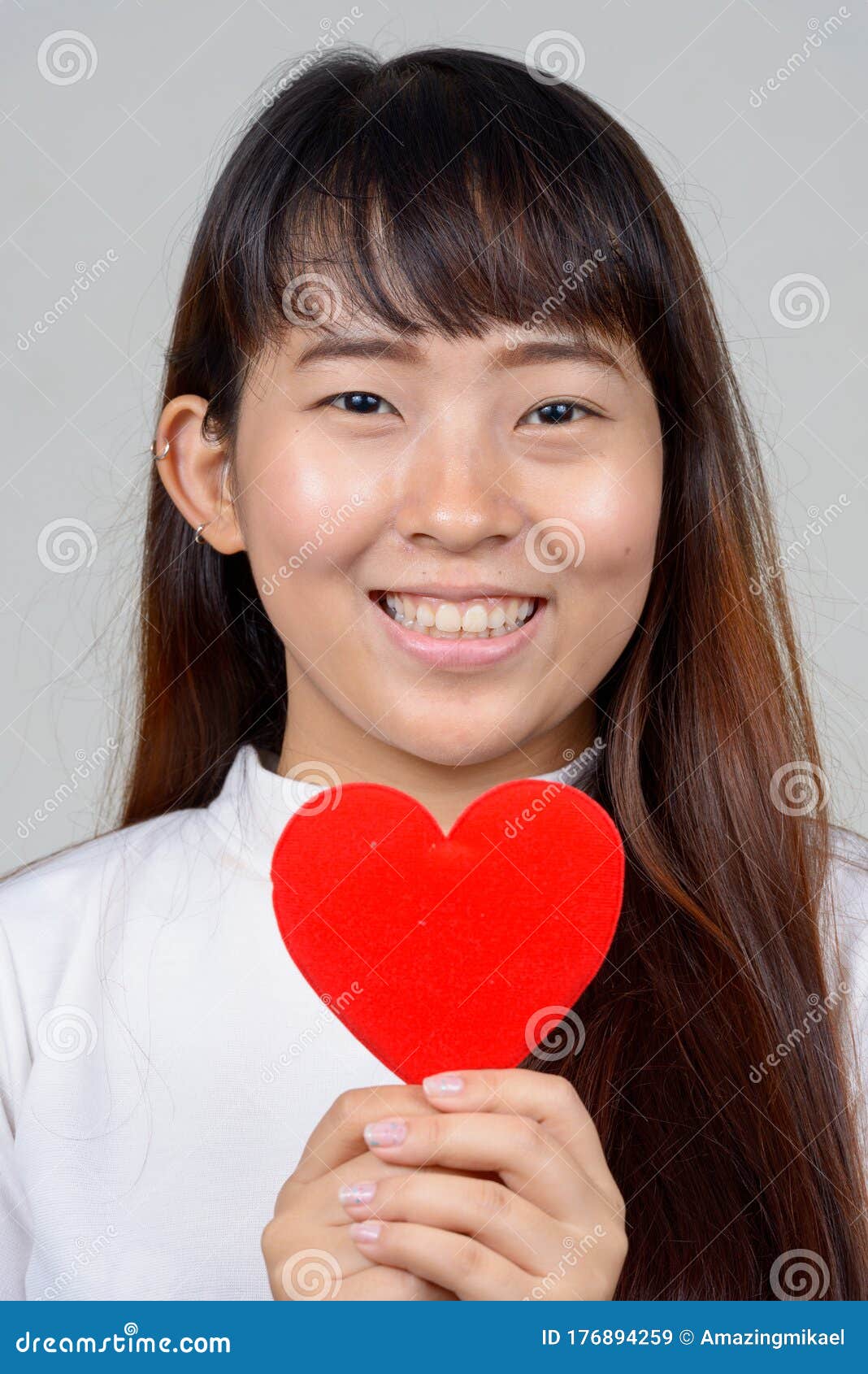 Face Of Happy Young Asian Woman Holding Heart Ready For Valentine`s Day