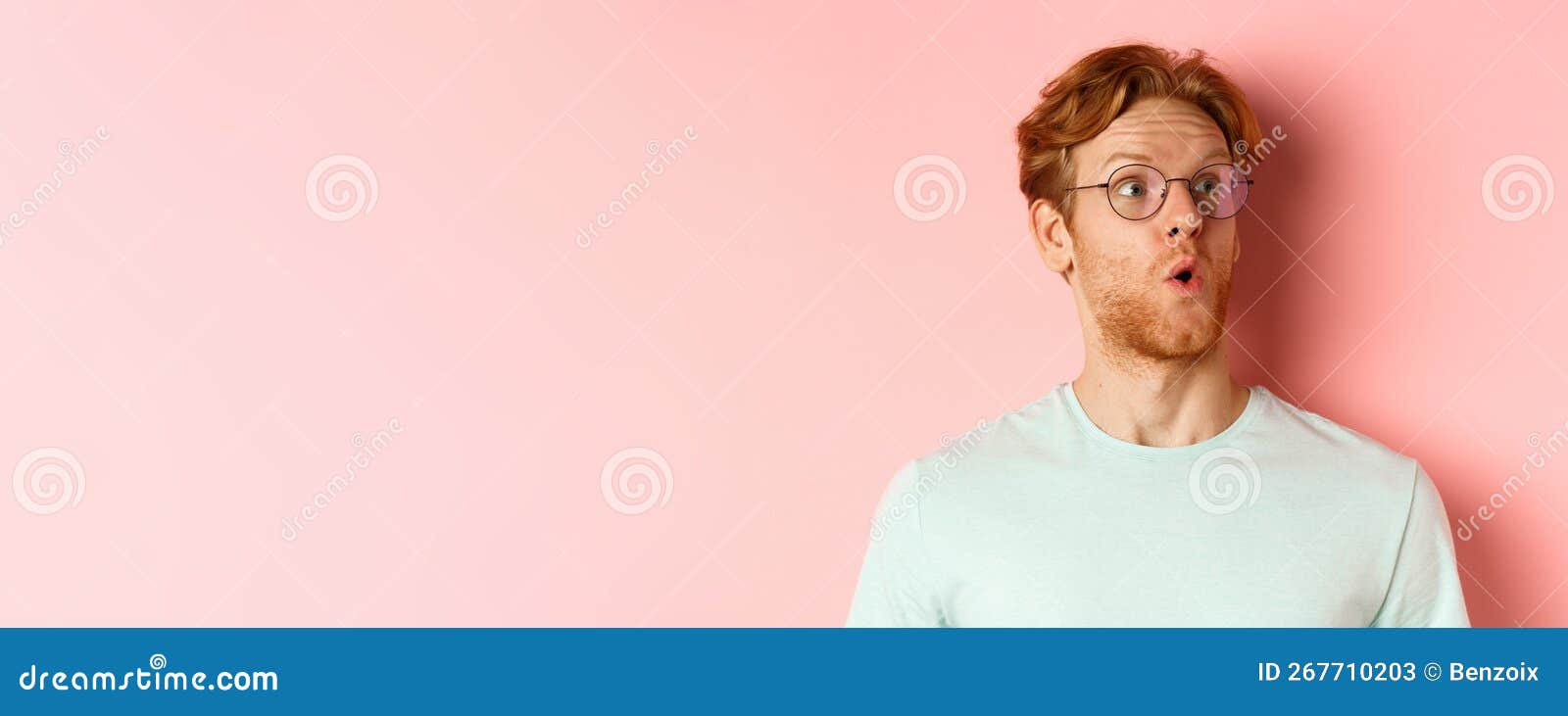 Face Of Intrigued Young Man With Ginger Hair And Beard Raising