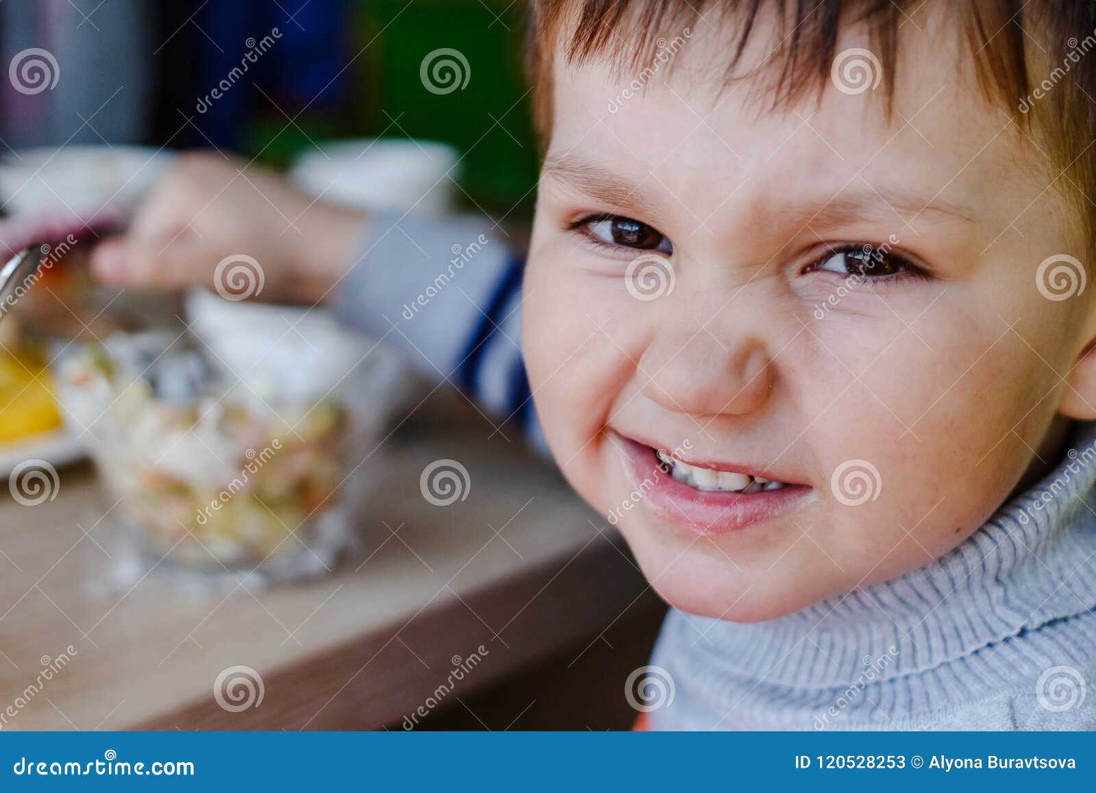 The Face of a Little Boy at the Dining Table Stock Image - Image of ...