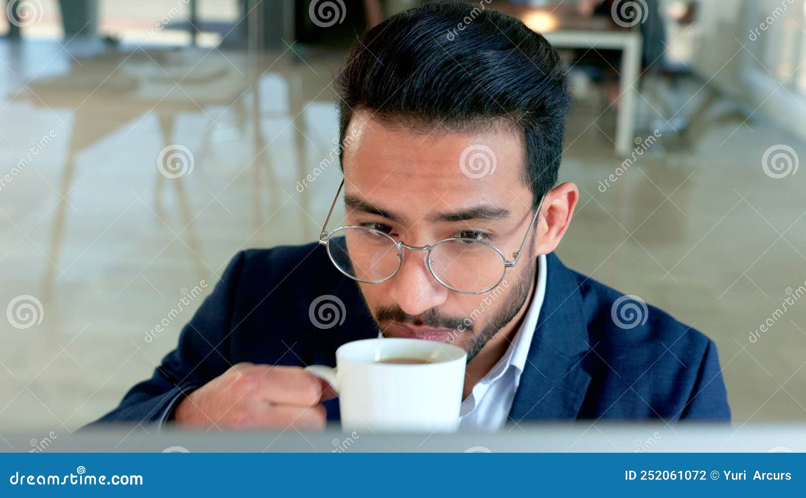 Face of a Marketing Manager Drinking a Cup of Coffee and Working on a ...