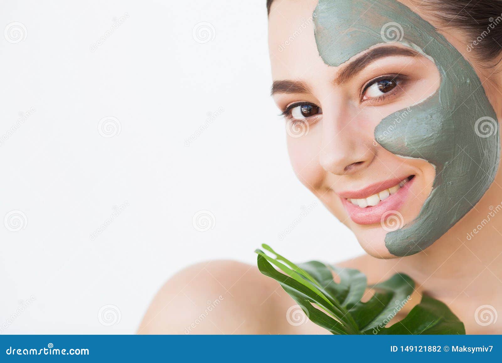 Face Mask. Beautiful Smiling Woman Applying Mask on Face Stock Photo ...