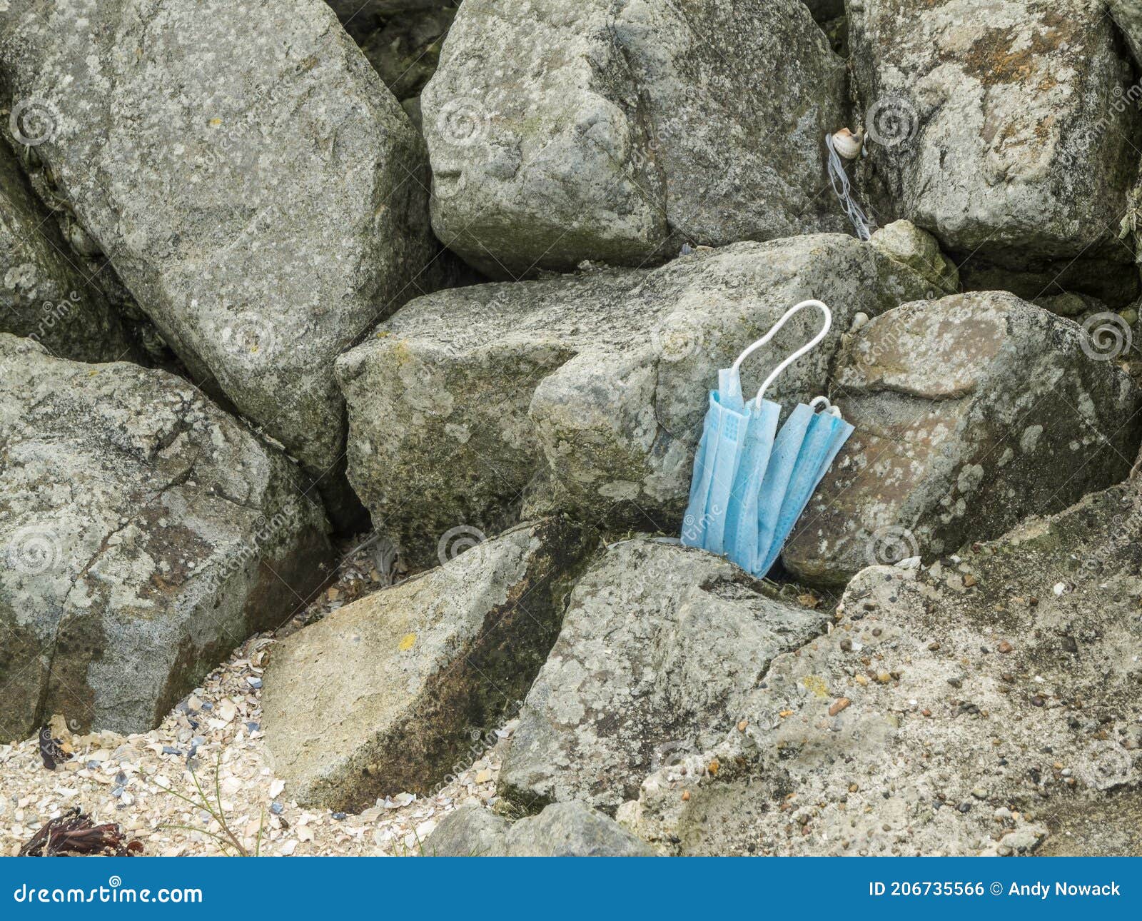 Face mask on boulders stock photo. Image of cloth, disposable - 206735566