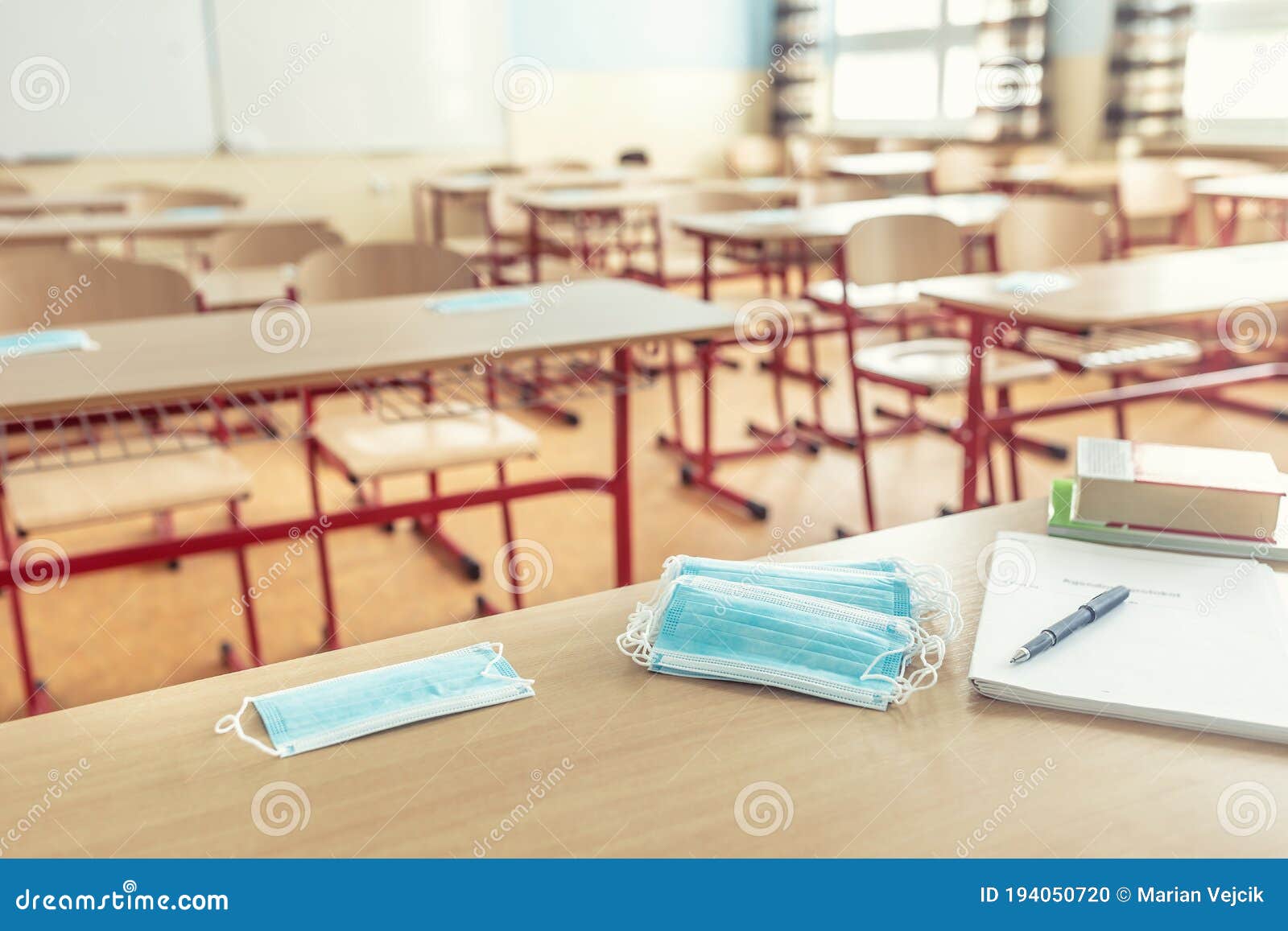 Face Mask on a Teachers and School Desk in a School Classroom Stock ...