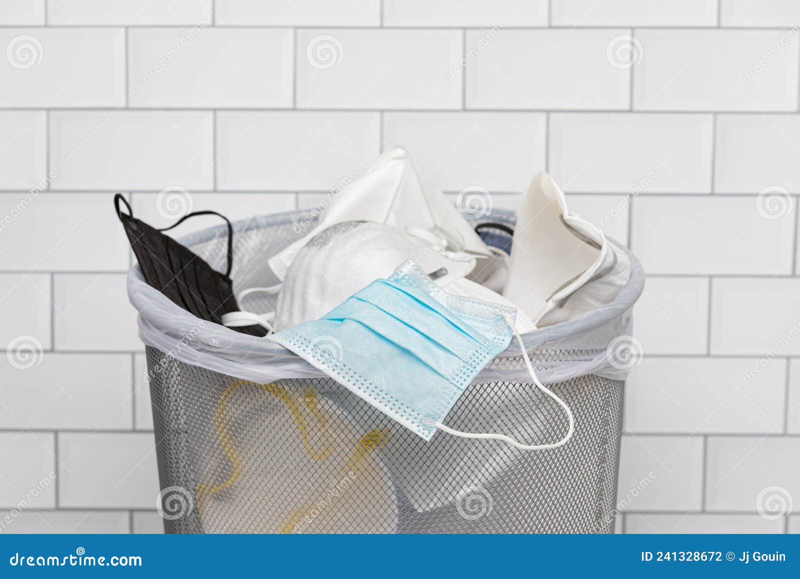 Face masks in garbage can. stock photo. Image of copy - 241328672