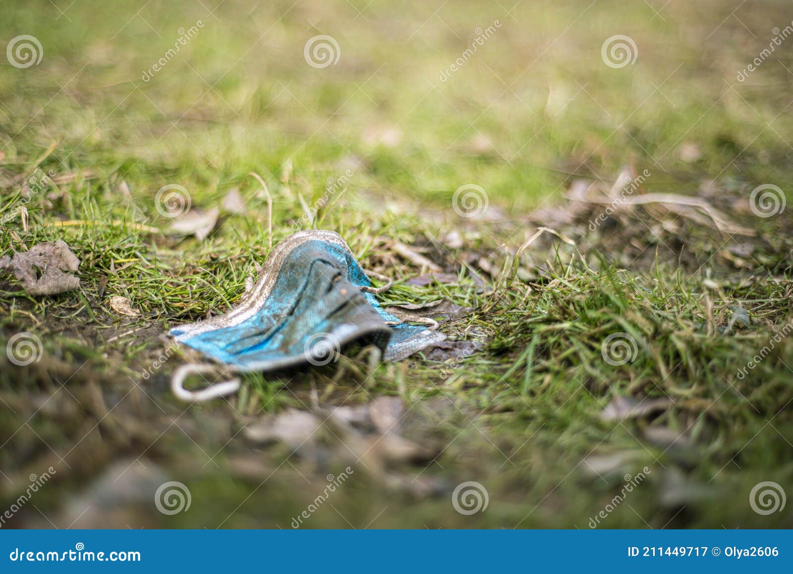 Face Masks Pollution, Blue Mask Covered in Mud in the Forest, Stock ...