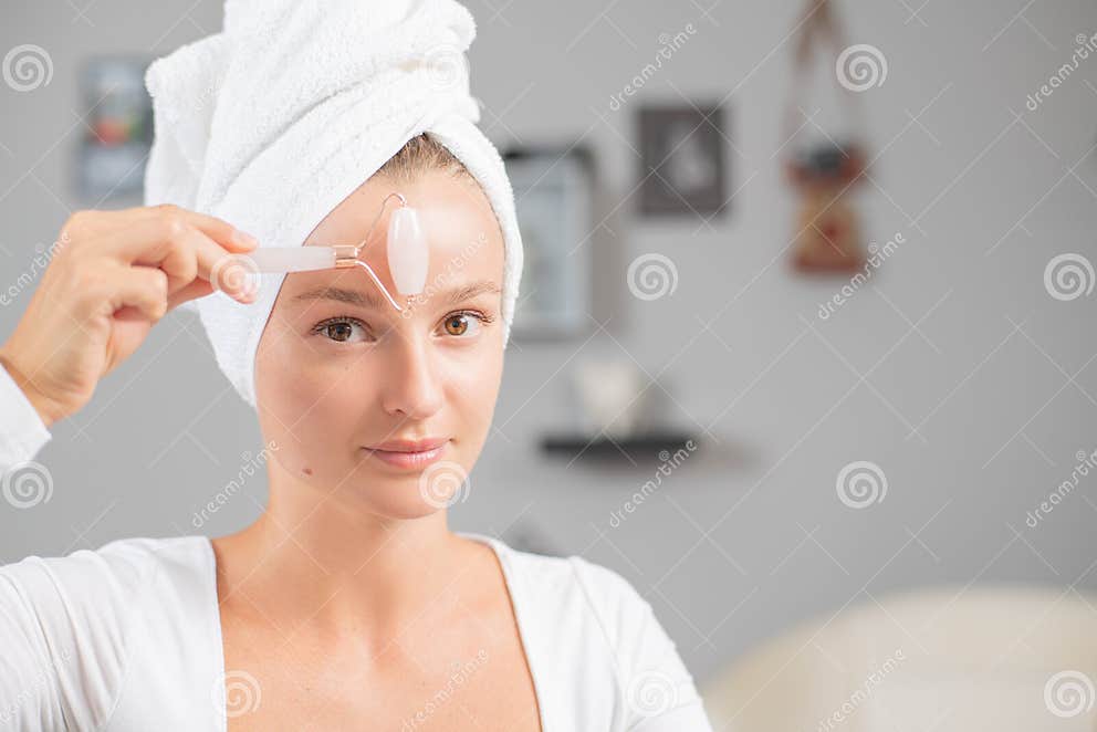 Face Massage Beautiful Woman Is Getting Massage Face Using Jade Facial