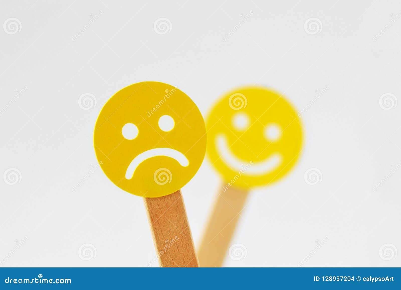 Face with Negative Expression in Front of Out of Foucs Smiley Fa Stock ...