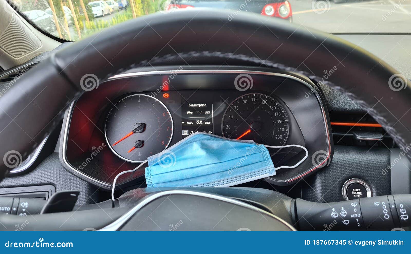 A Face Protection Mask Lay on a Dashboard in a Car Stock Image - Image ...