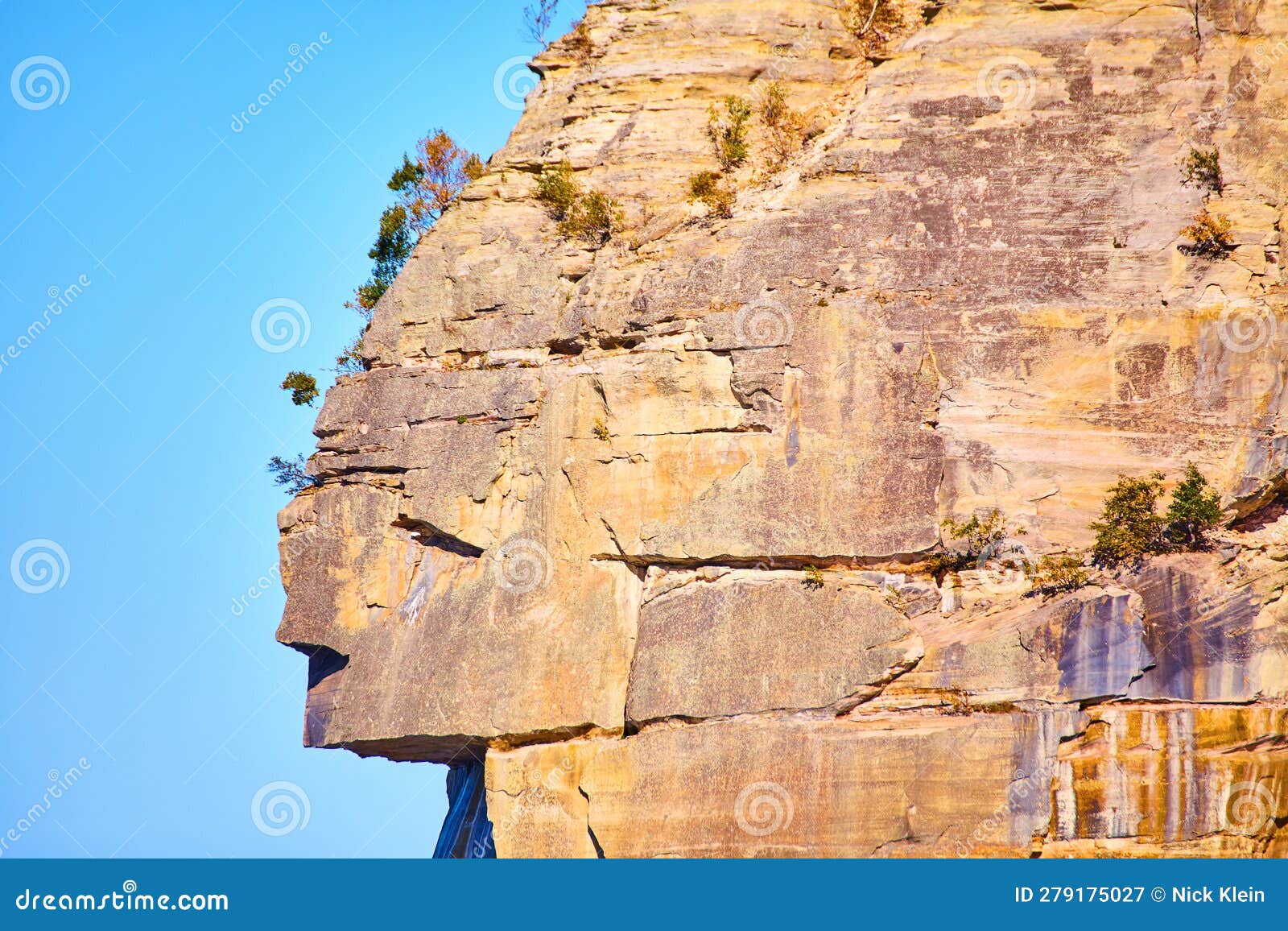 Face in Stone Cliff Wall of Pictured Rocks with Clear Blue Sky Stock ...