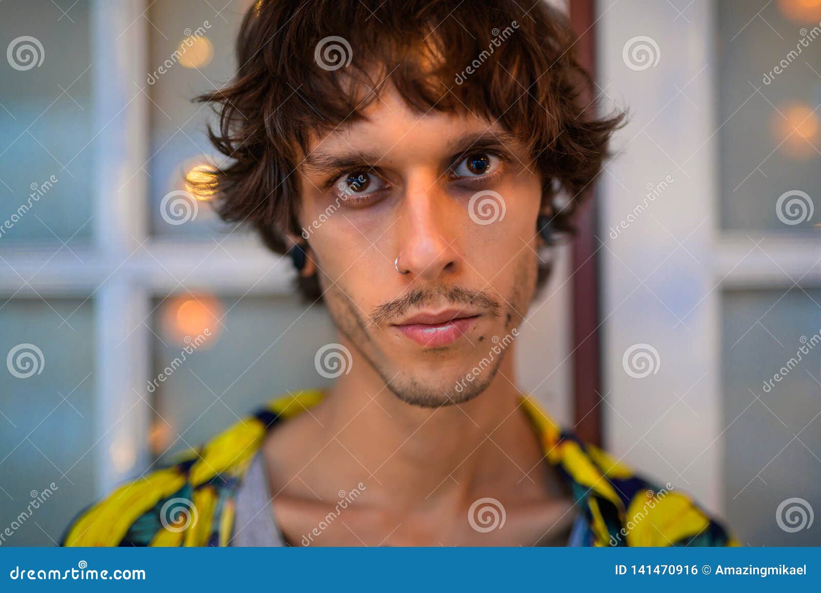 Face of Young Rebellious Man Looking at Camera Outdoors Stock Photo ...