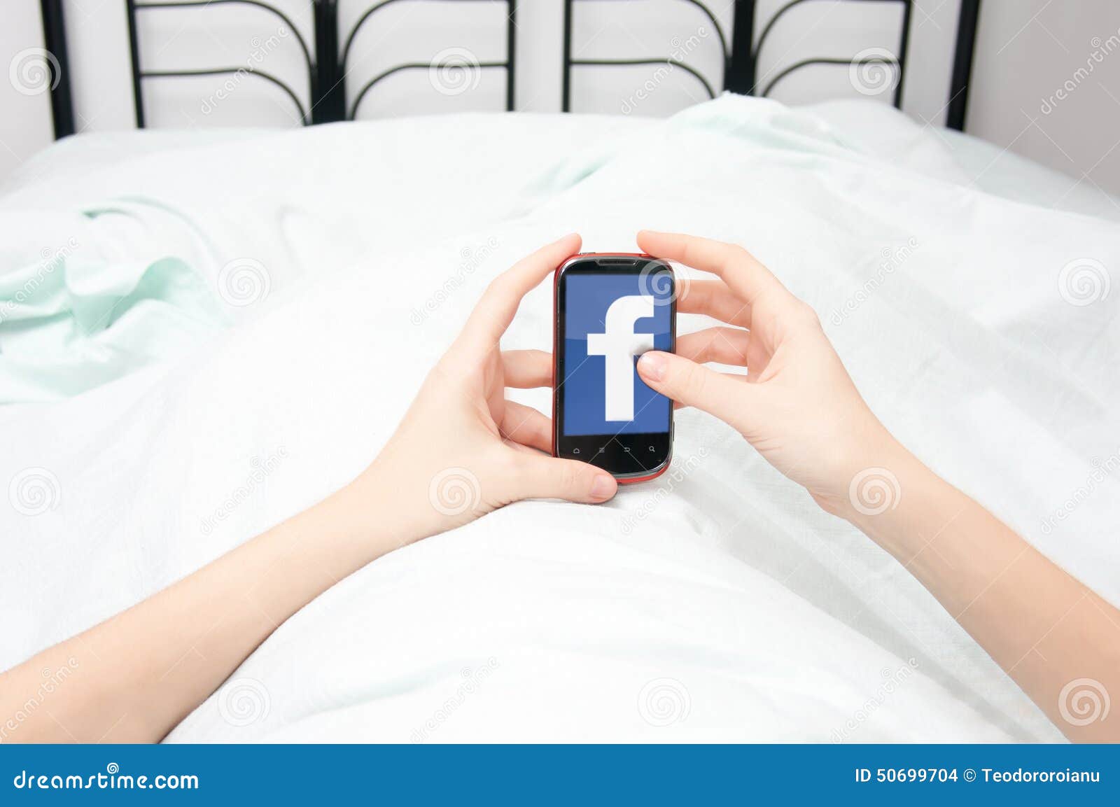 Facebook browsing in bed editorial stock image. Image of input - 50699704