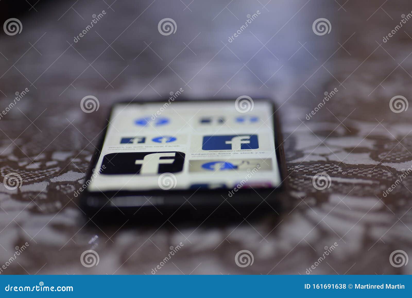 Facebook logo on mobile editorial stock photo. Image of button - 161691638