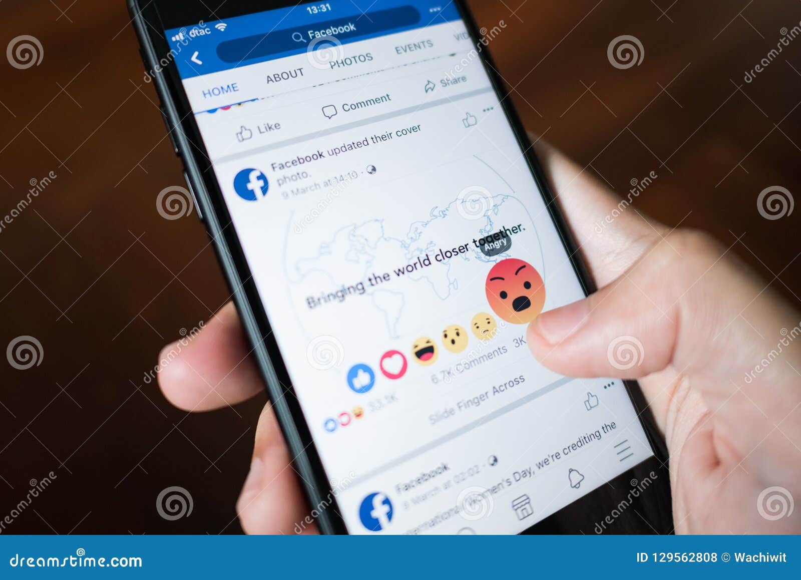 Facebook User Touch on Angry Button in Facebook Application on IPhone 7 ...