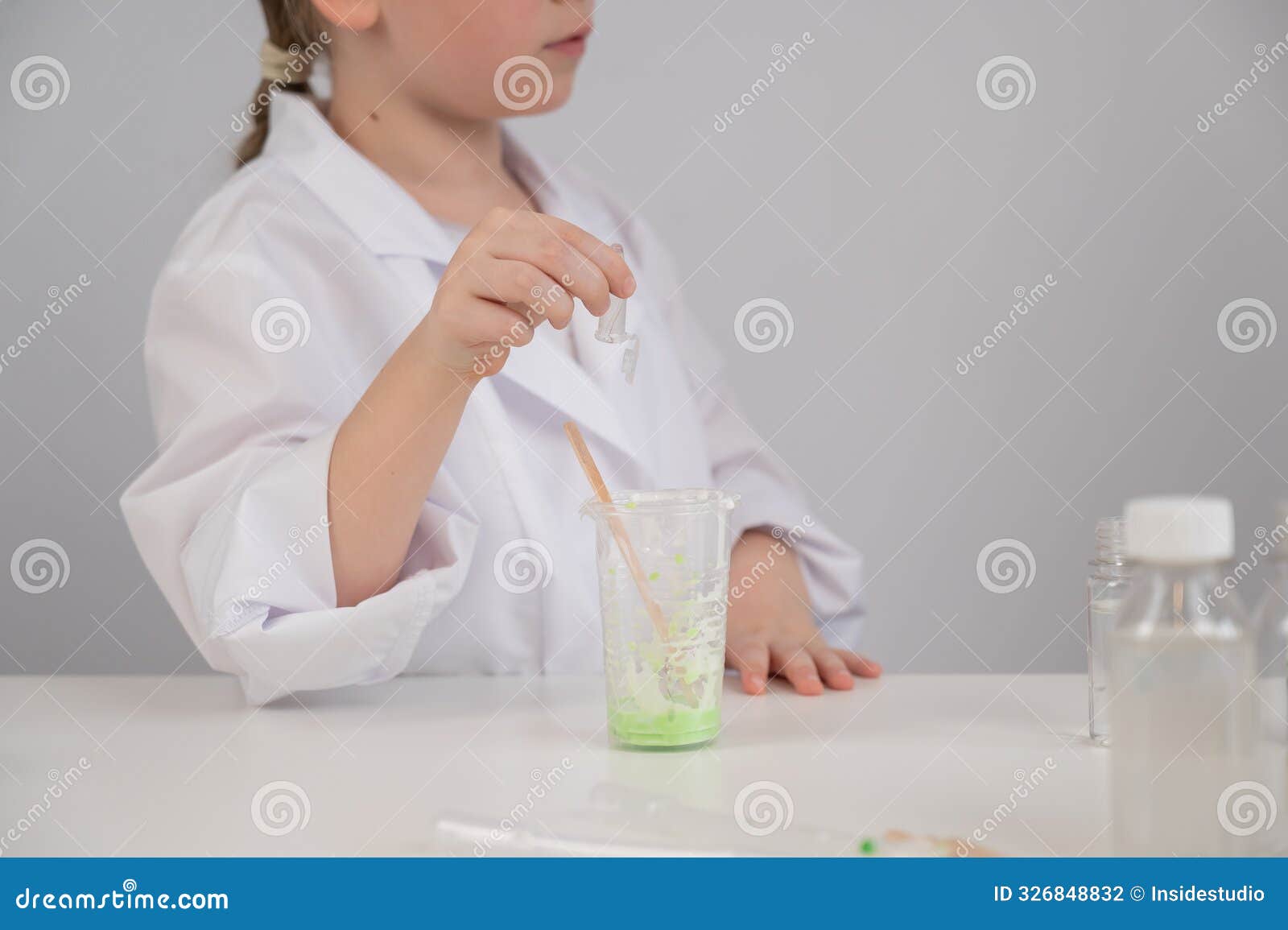Faceless Girl Doing Chemical Experiments On A White Background. Making ...