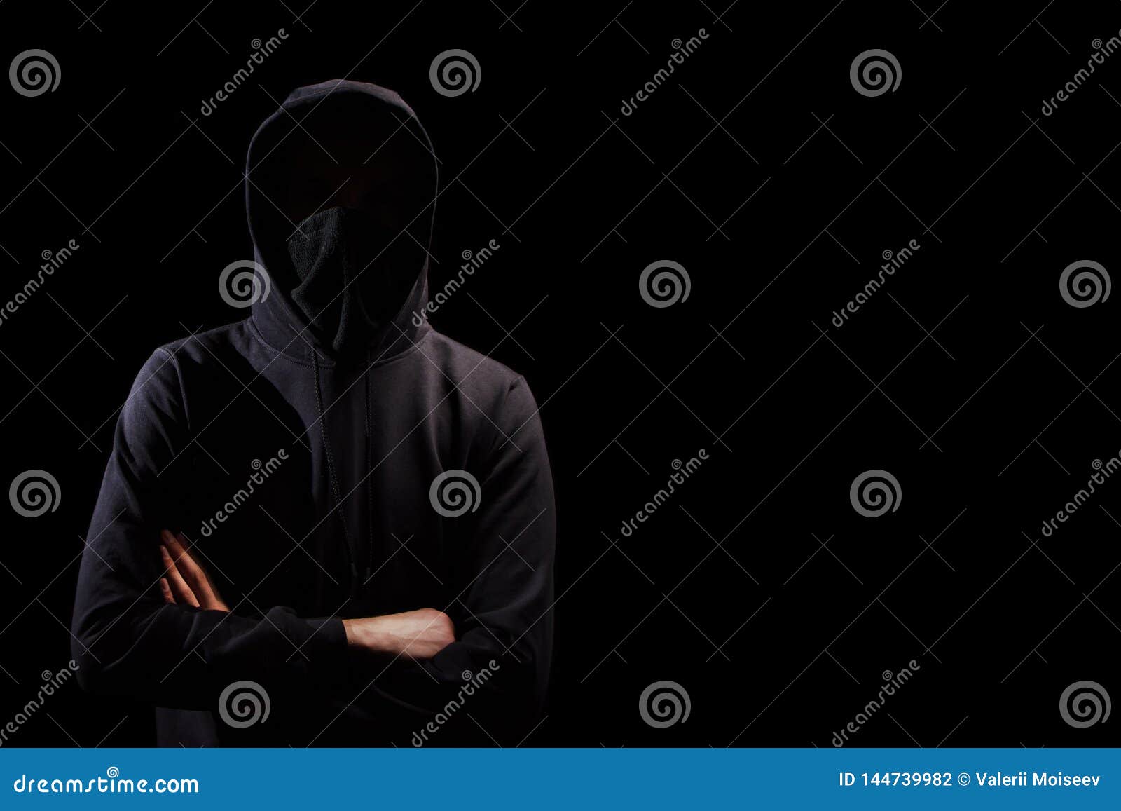 Faceless Man in Hoodie Standing on Black Stock Photo - Image of closeup ...