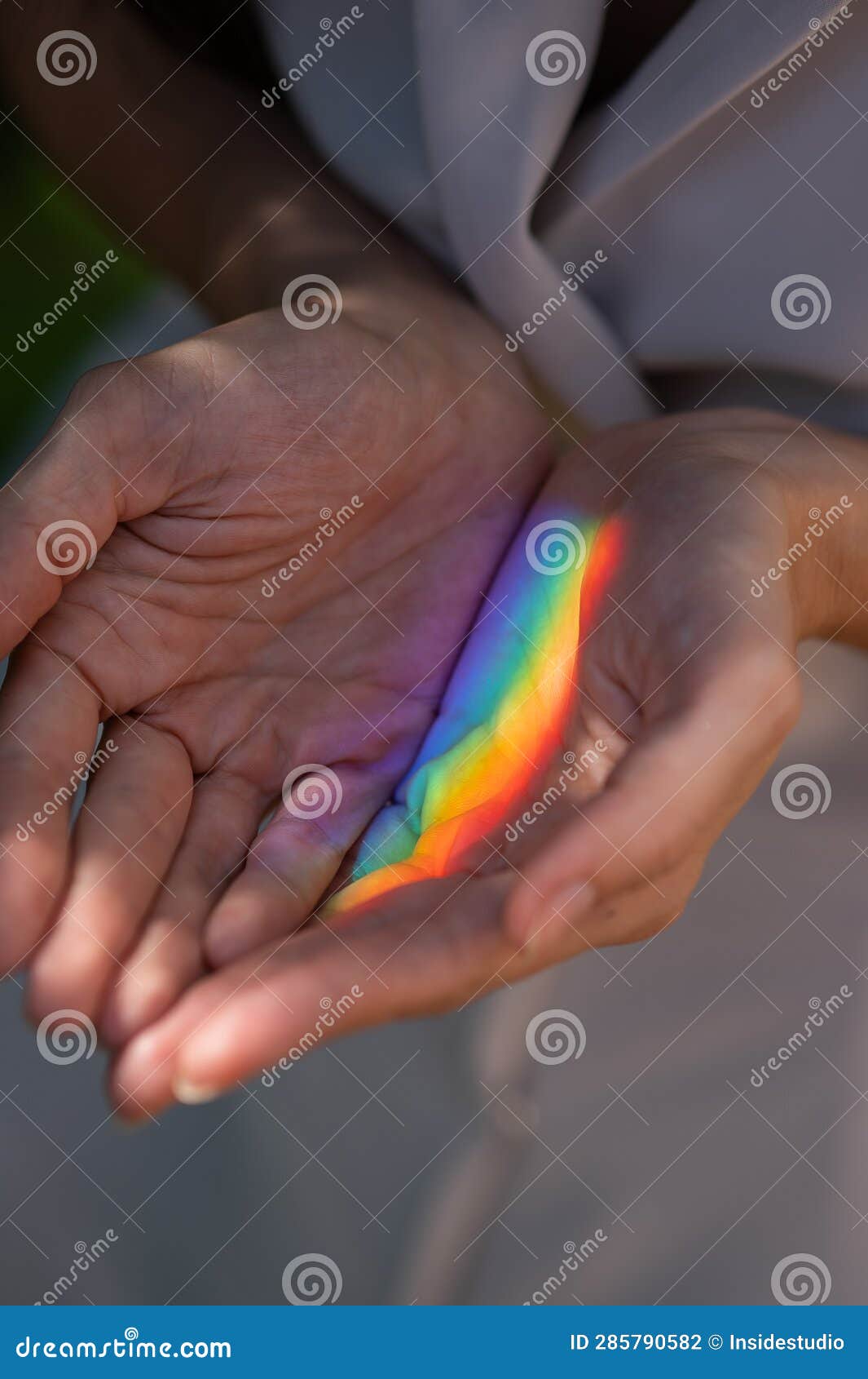 Faceless Woman Catching Rainbow Ray with Her Hands Outdoors. Stock ...