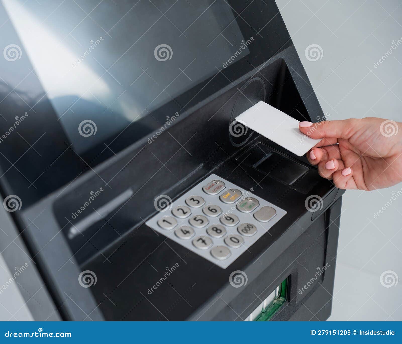 A Faceless Woman Inserts a Credit Card into an ATM. Close-up of a Woman ...