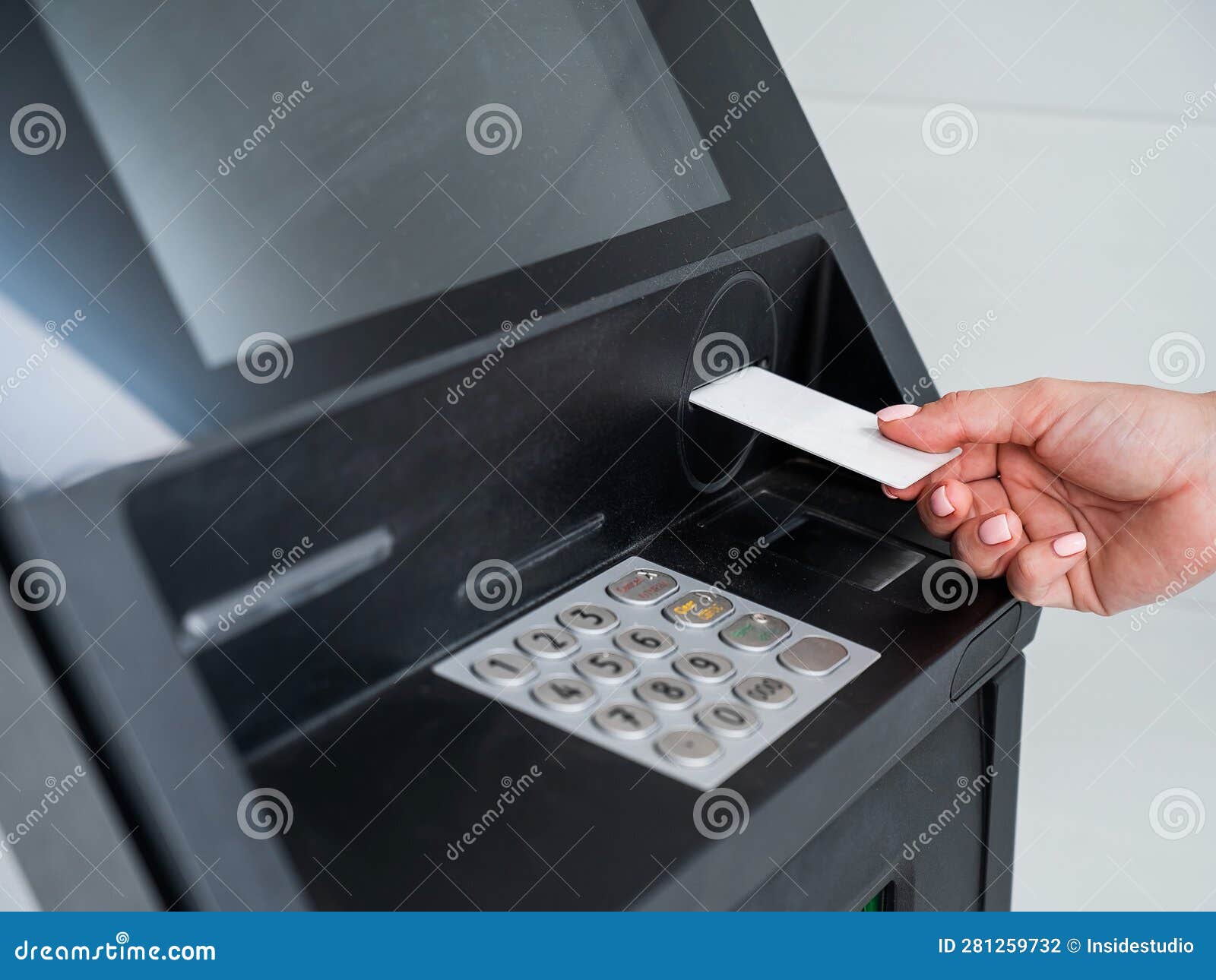 A Faceless Woman Inserts a Credit Card into an ATM. Close-up of a Woman ...