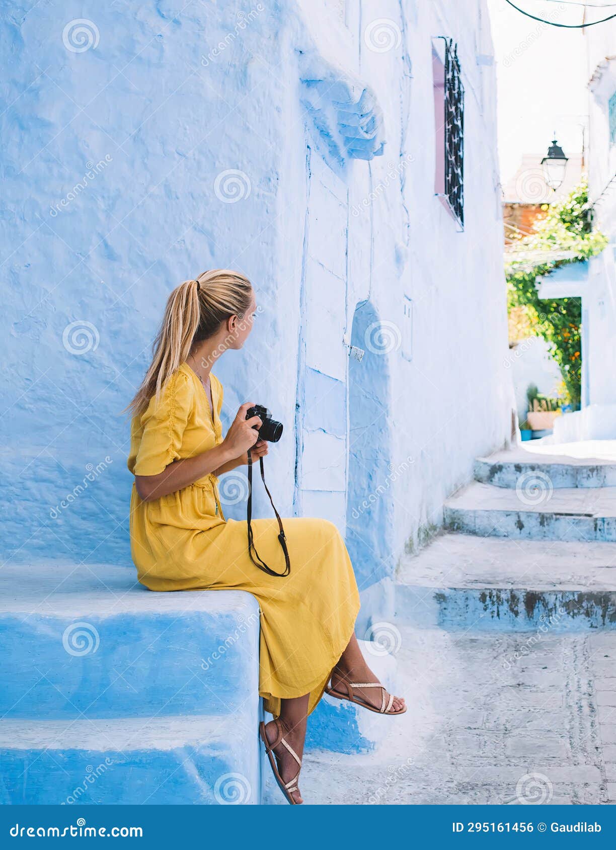 Faceless Woman Using Camera Sitting in Street Stock Photo - Image of ...