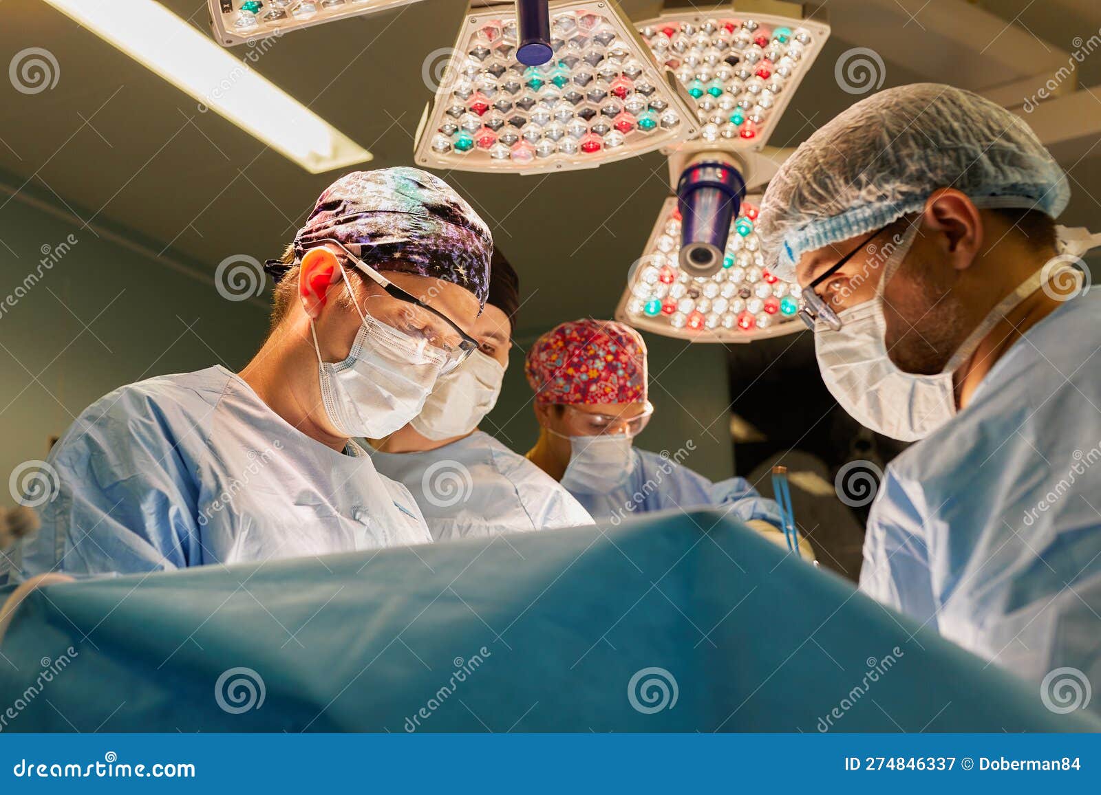 The Faces of Doctors Surgeons in Masks are a Big Plan, an Operating Room, a Surgeon Performs an ...