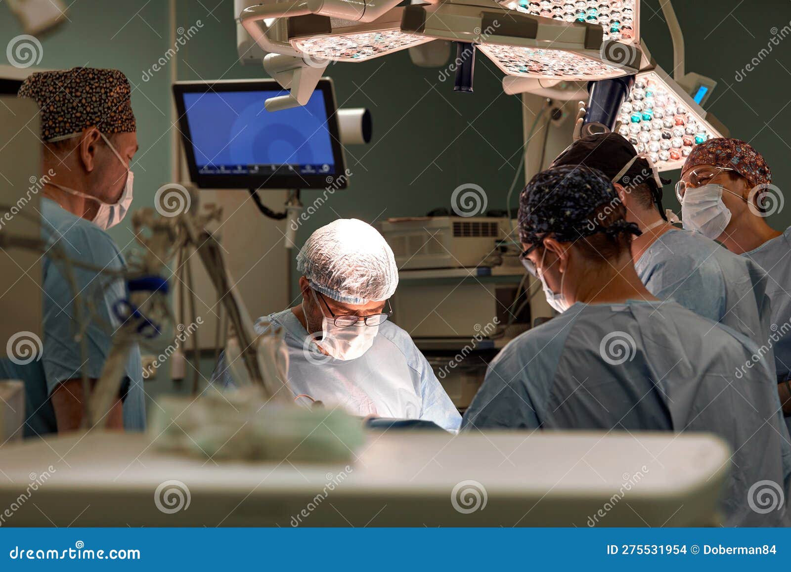 The Faces of Doctors Surgeons in Masks are a Big Plan, an Operating Room, a Surgeon Performs an ...