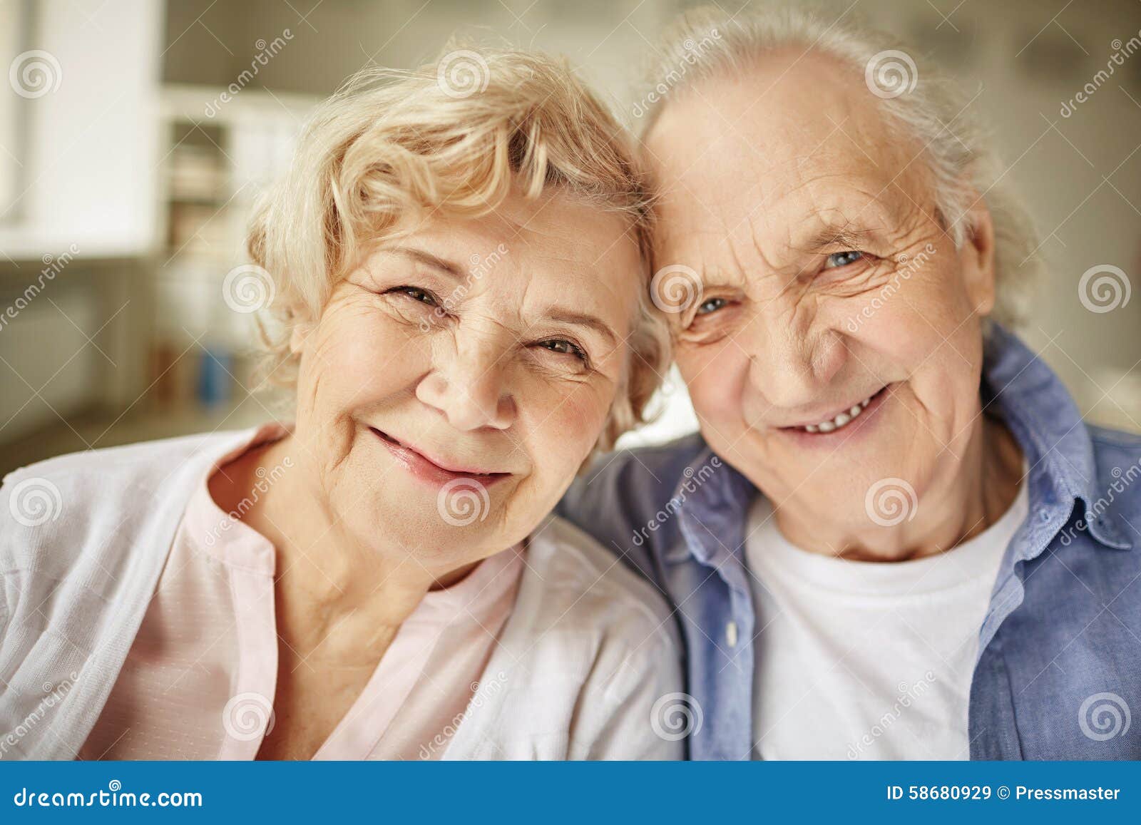 Faces of senior couple stock image. Image of looking - 58680929