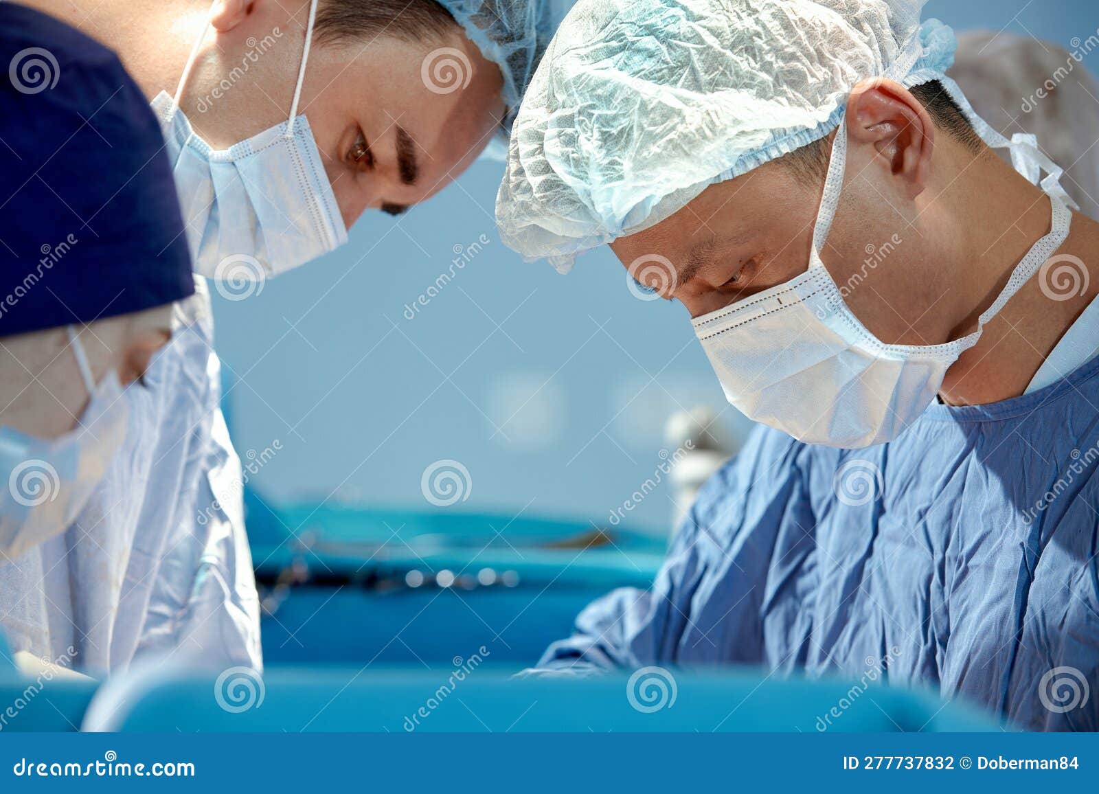 Faces of Surgeons Close-up during a Complex and Intense Operation ...