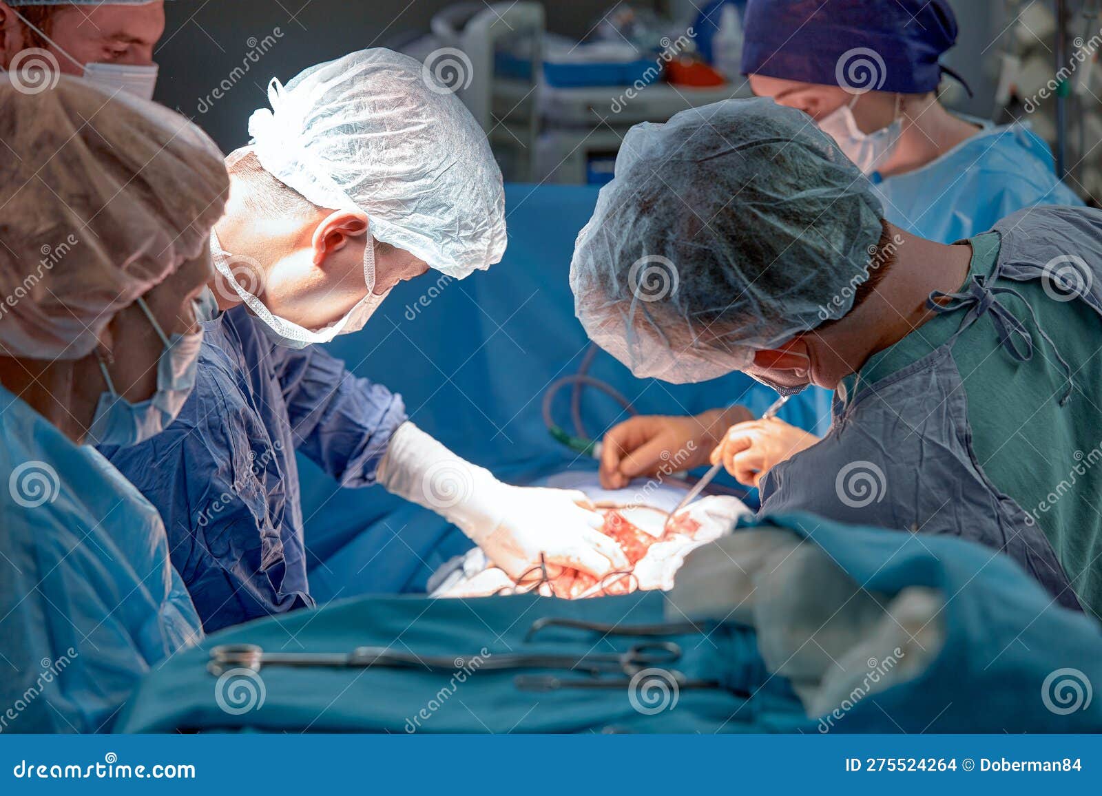 Faces of Surgeons in the Operating Room during the Operation. Modern ...
