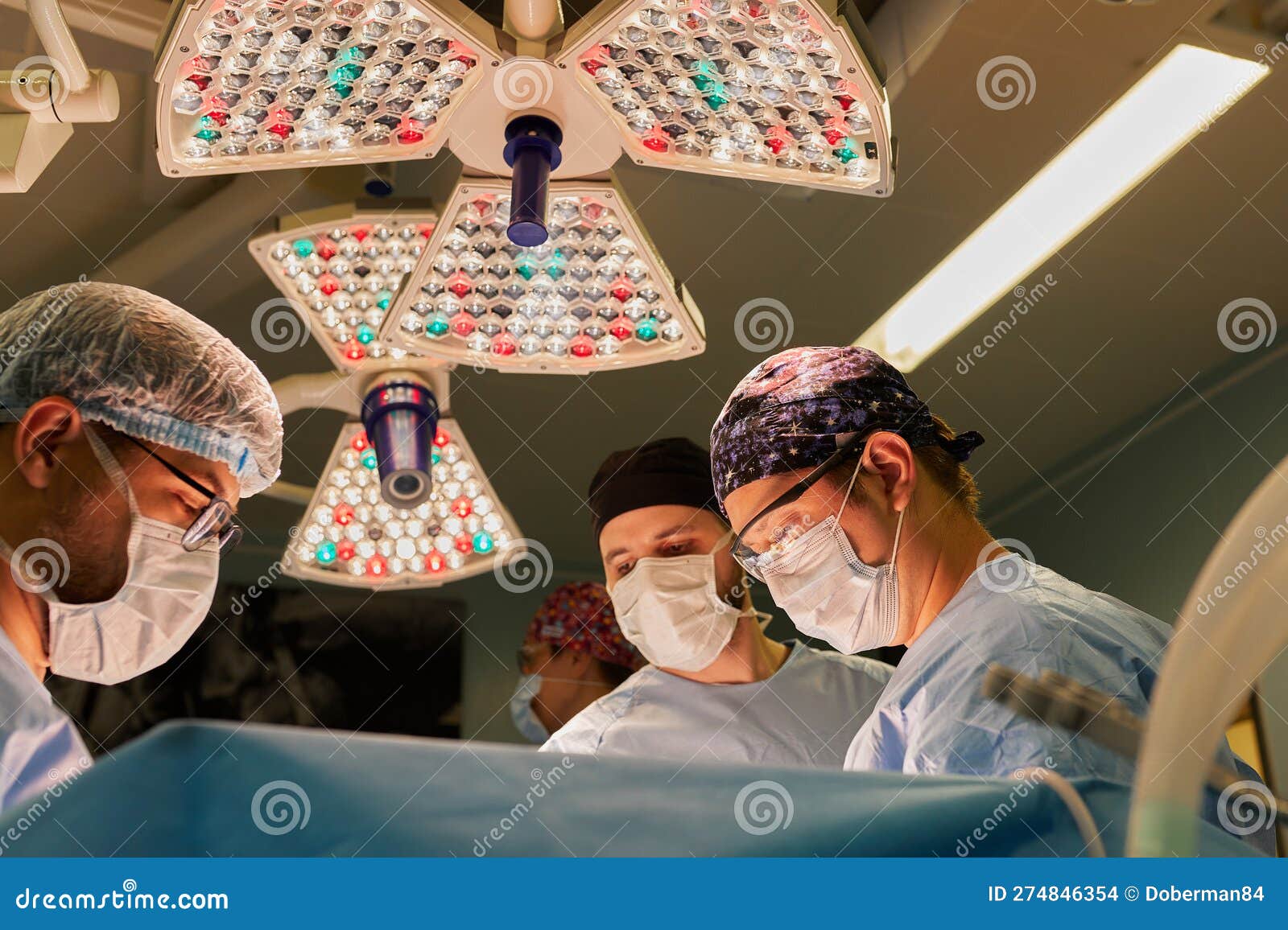 Faces of Surgeons in the Operating Room during the Operation. Modern ...
