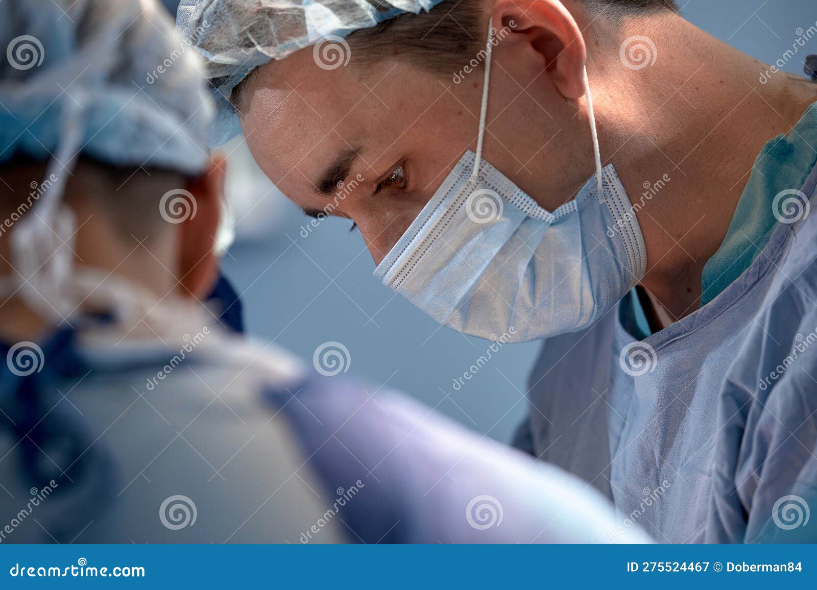 Faces of Surgeons in the Operating Room during the Operation. Modern ...