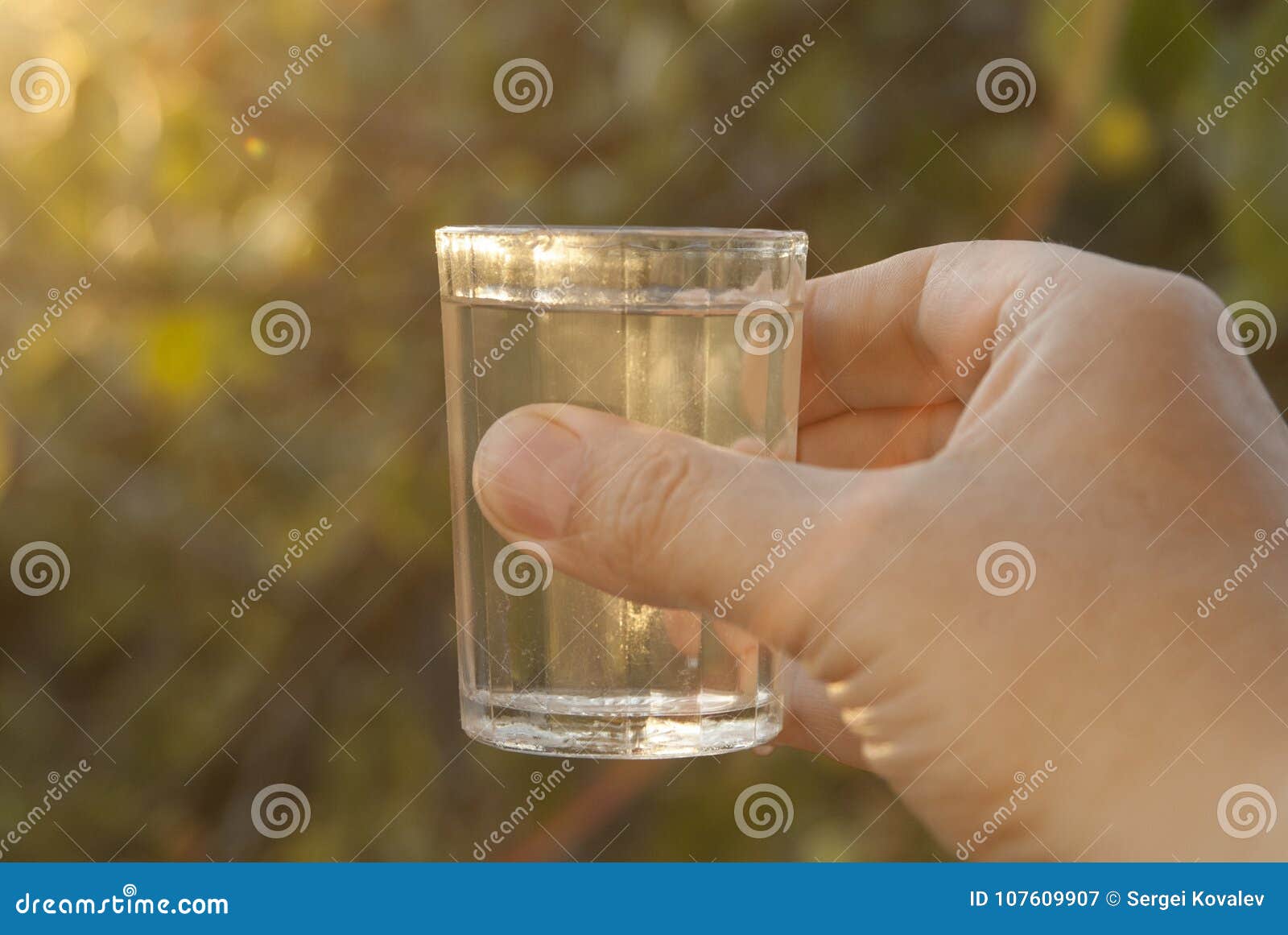 Faceted Glass of Vodka in His Hand. Stock Image - Image of glass ...