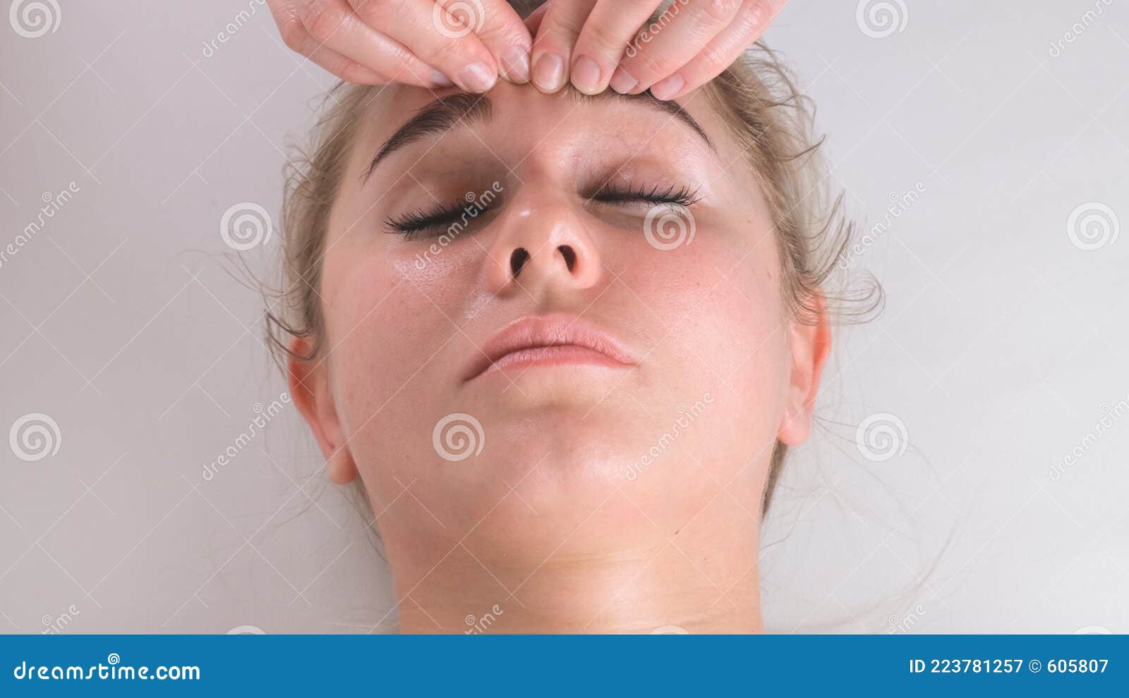Facial Massage Beauty Treatment Close Up Of A Young Womans Face Lying