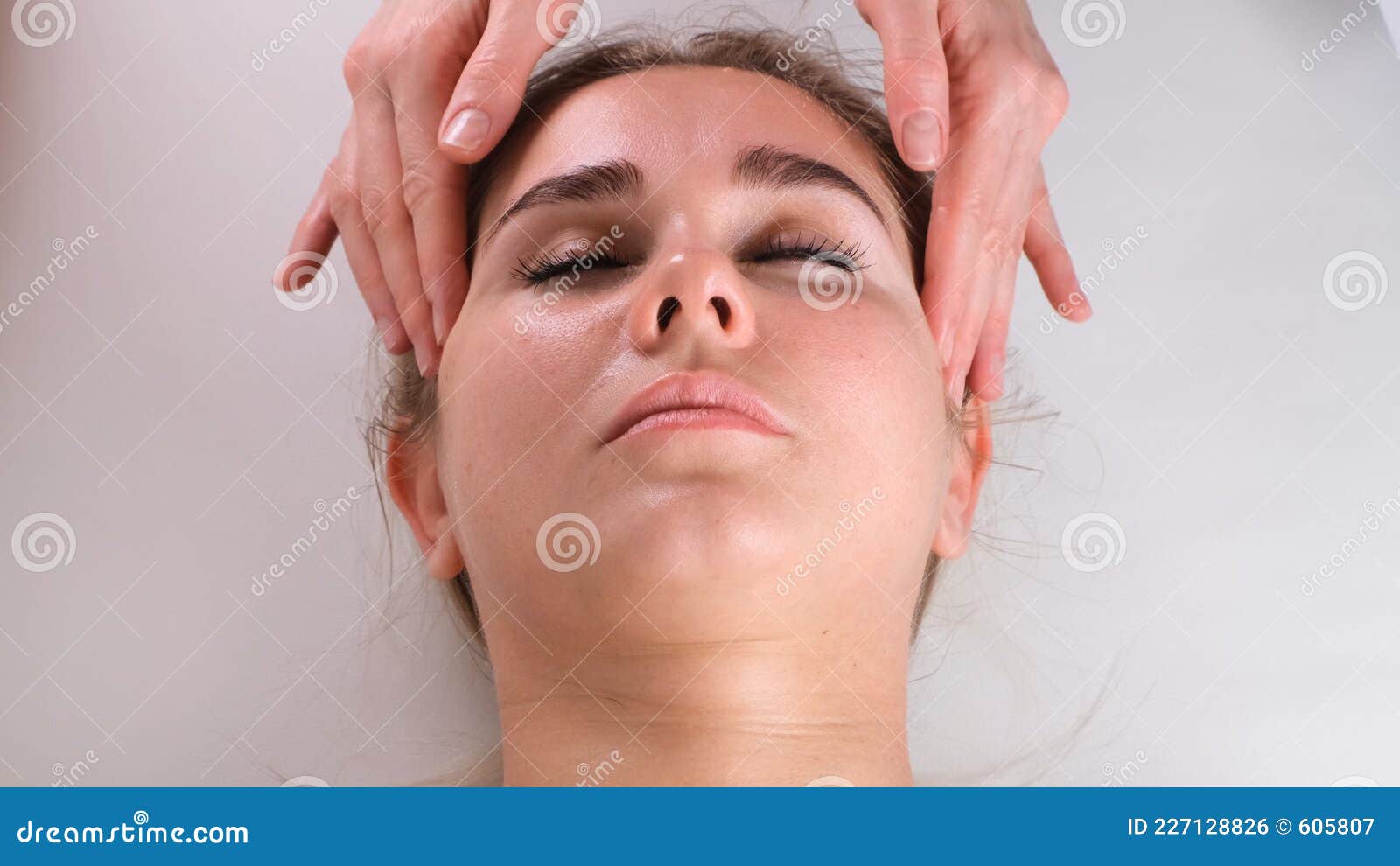 Facial Massage Beauty Treatment Close Up Of A Young Womans Face Lying