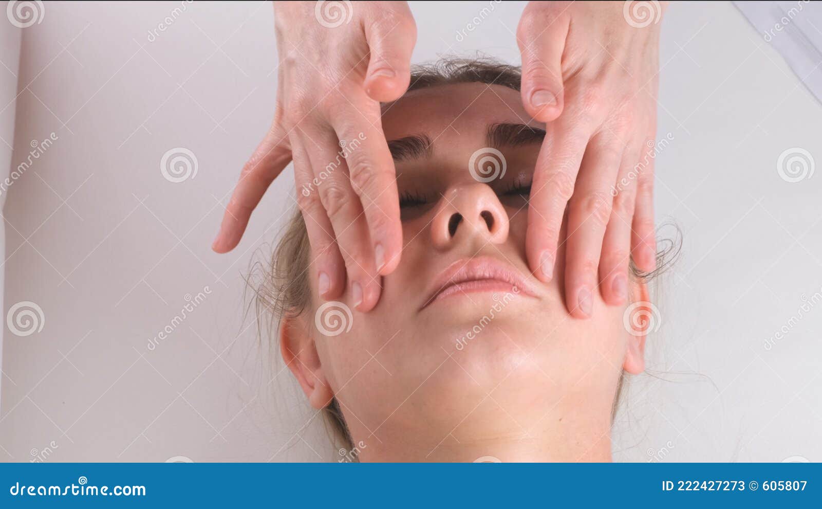 Facial Massage Beauty Treatment Close Up Of A Young Womans Face Lying