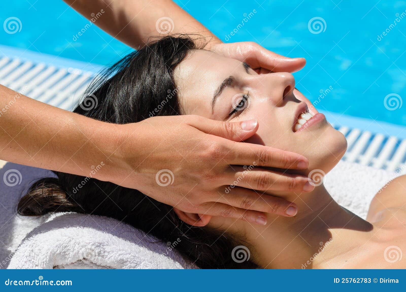 Facial massage at poolside stock image. Image of beautiful - 25762783