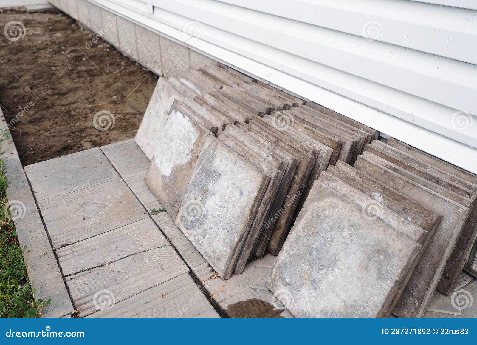 Facing Concrete Tiles Lie on Ground in Stack. Replacing Building ...