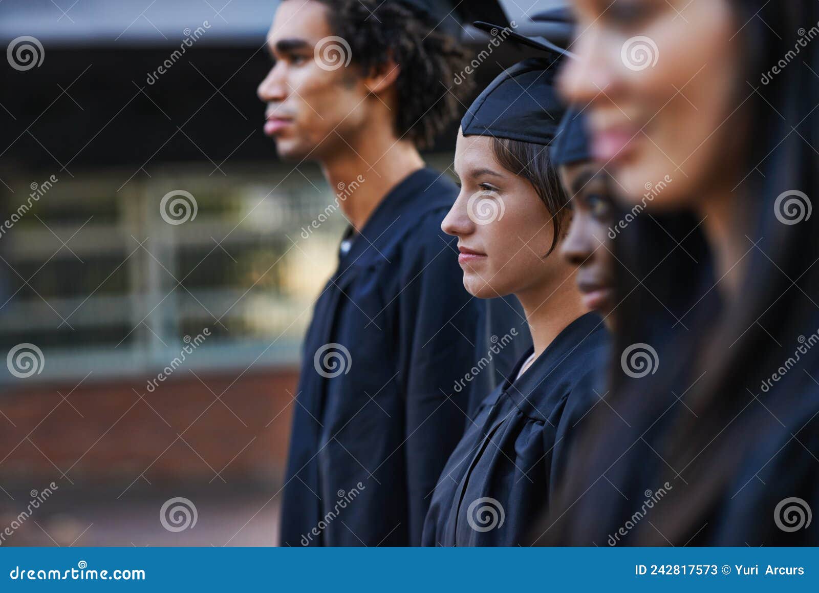 Facing Their Future As Graduates. a Group of Solemn College Graduates ...