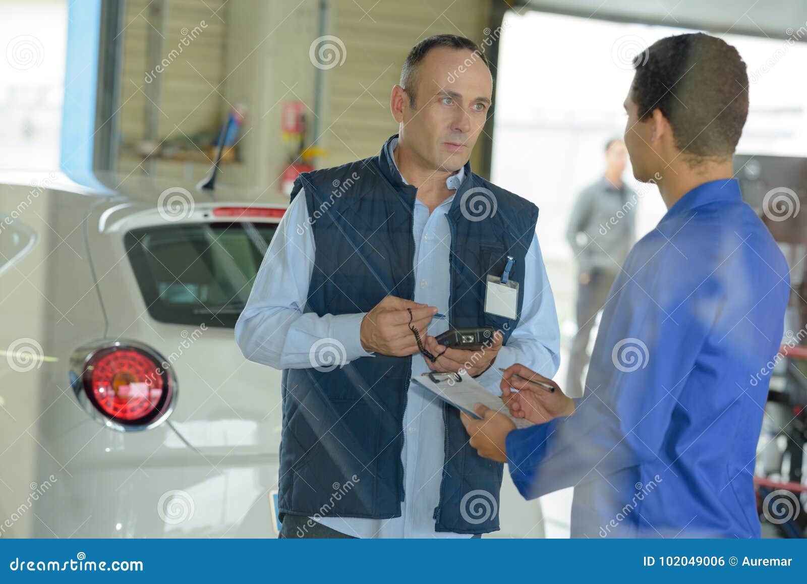 In Factory- Boss and Worker on Work Bench Stock Photo - Image of ...