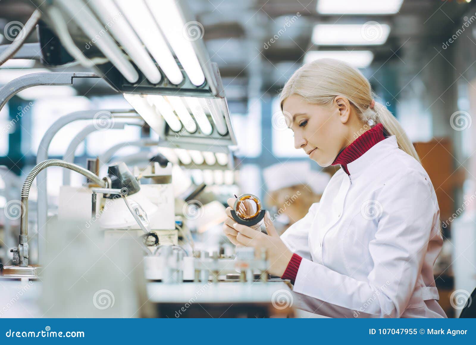 Factory electronics worker stock image. Image of device - 107047955