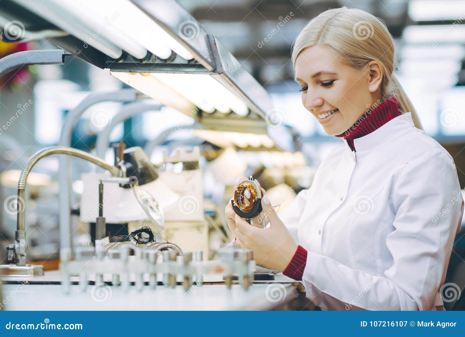 Factory electronics worker stock image. Image of device - 107216107