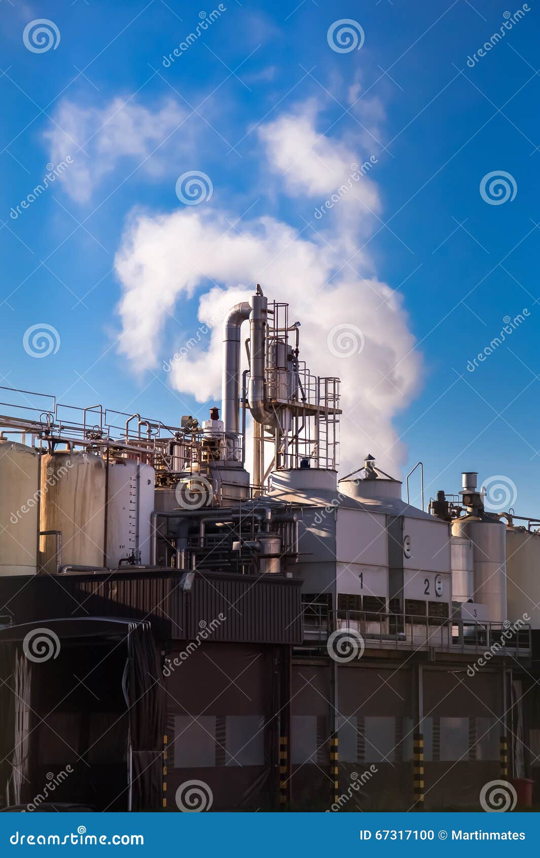 A factory emitting smoke stock photo. Image of factory - 67317100