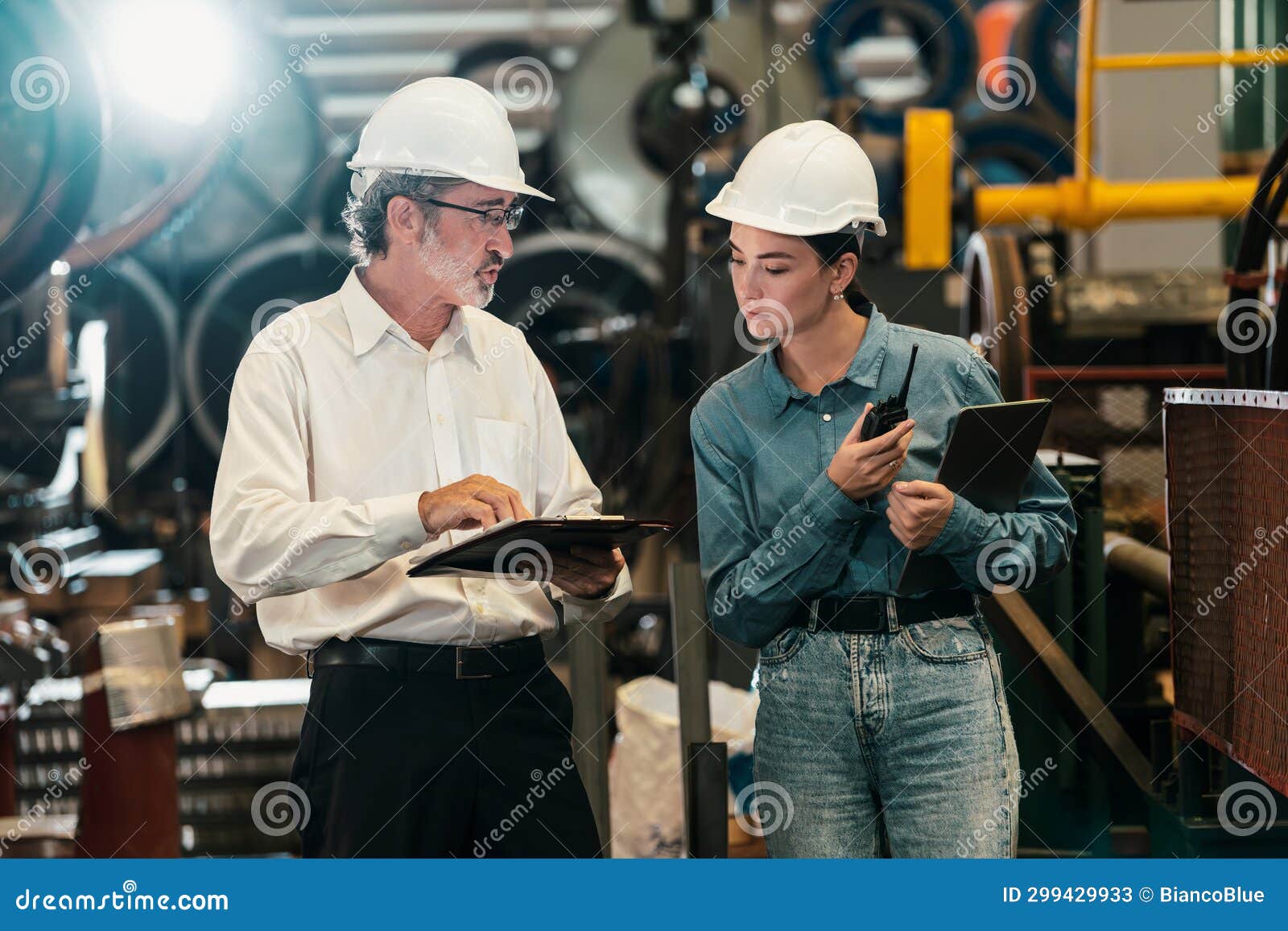 Factory Engineer with Assistant Using Laptop Inspect Factory ...