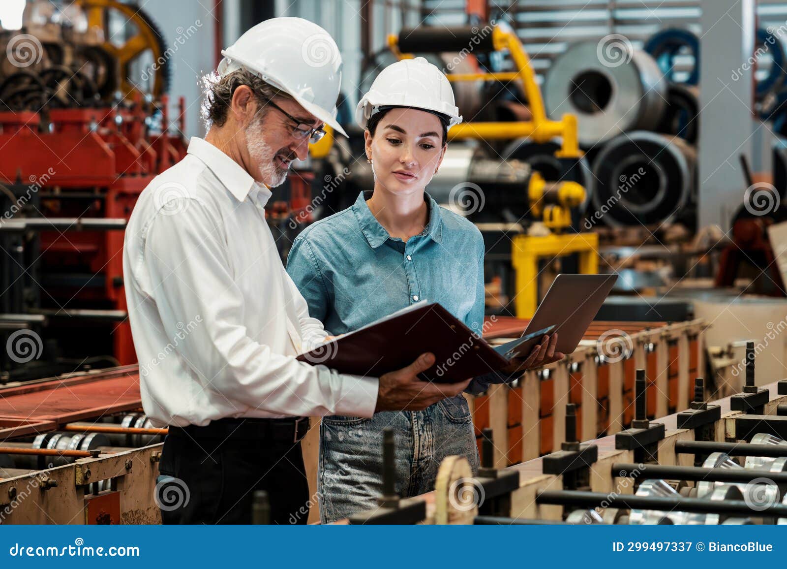 Factory Engineer with Assistant Using Laptop Inspect Factory ...
