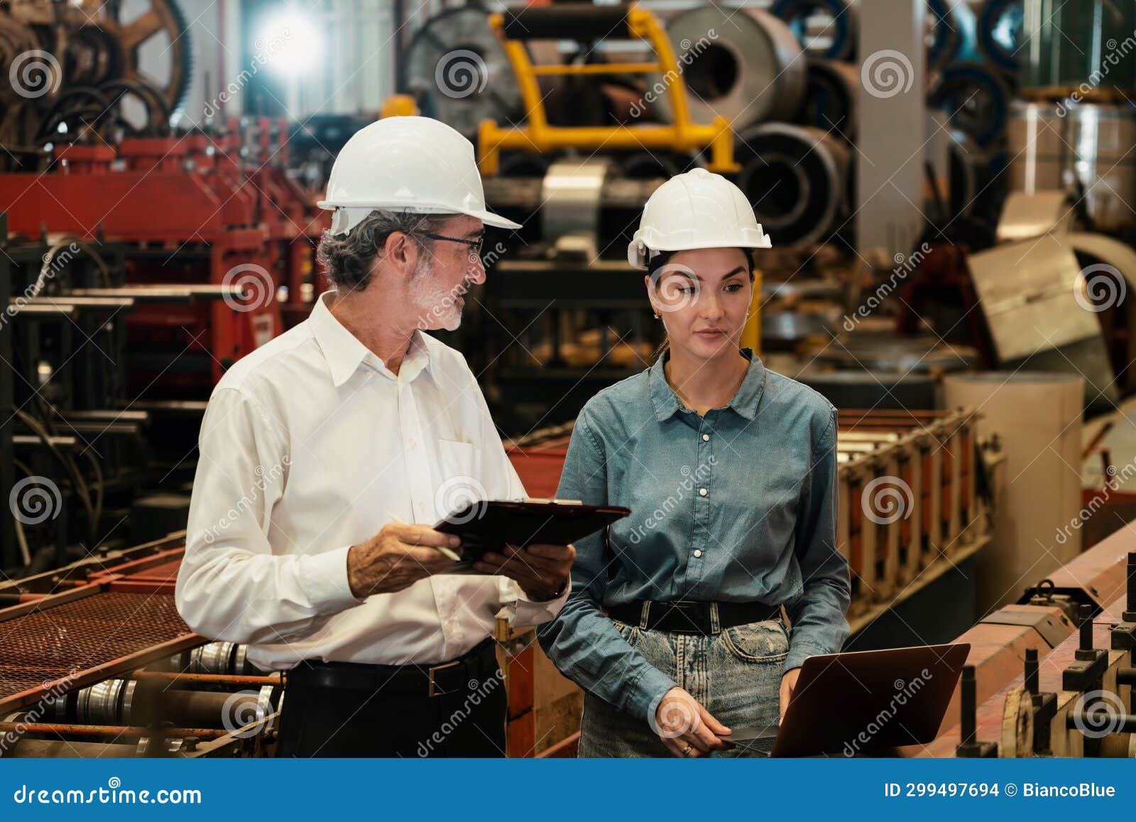 Factory Engineer with Assistant Using Laptop Inspect Factory ...
