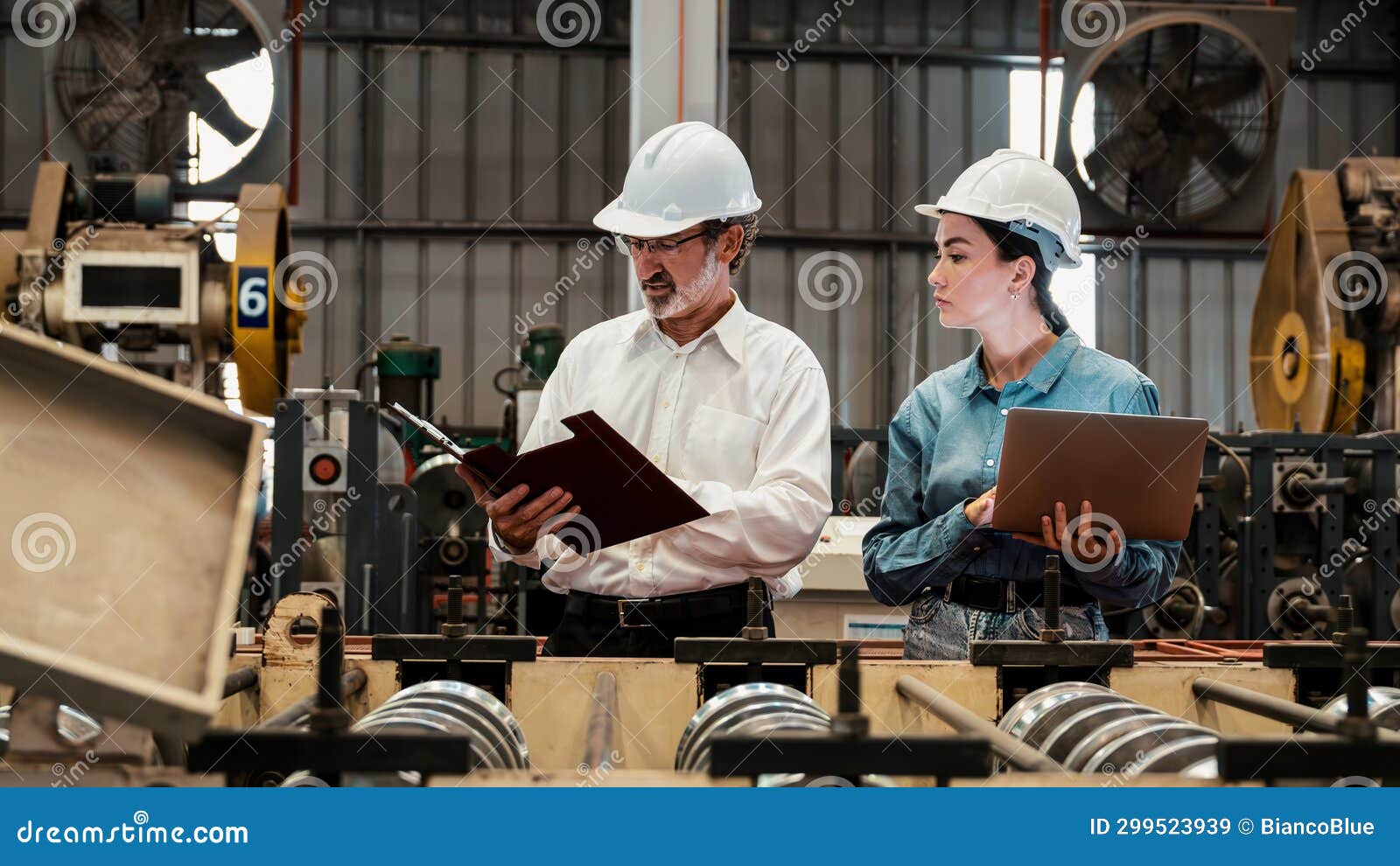 Factory Engineer with Assistant Using Laptop Inspect Factory ...