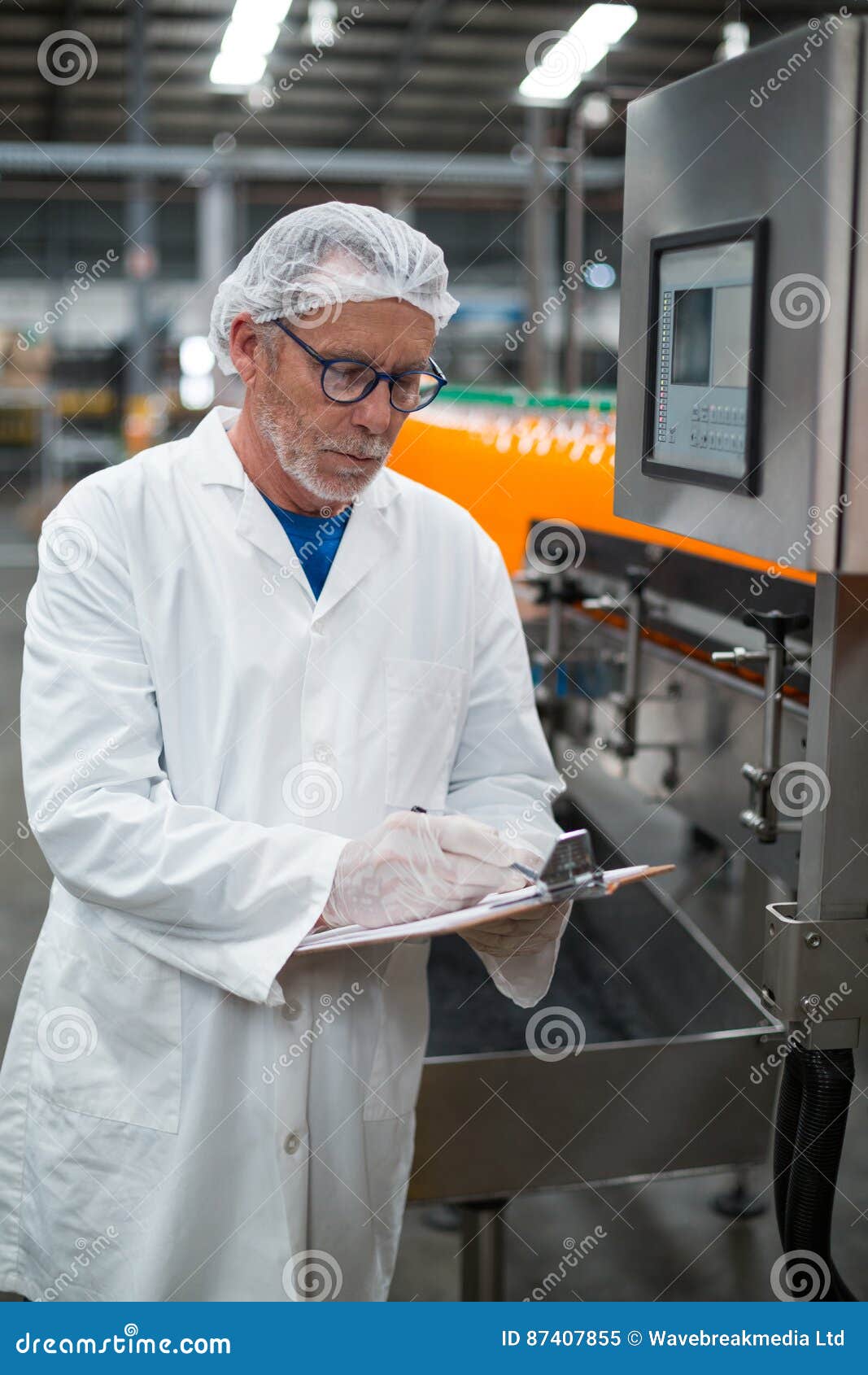 Factory Engineer Maintaining Record on Clipboard in Factory Stock Image ...