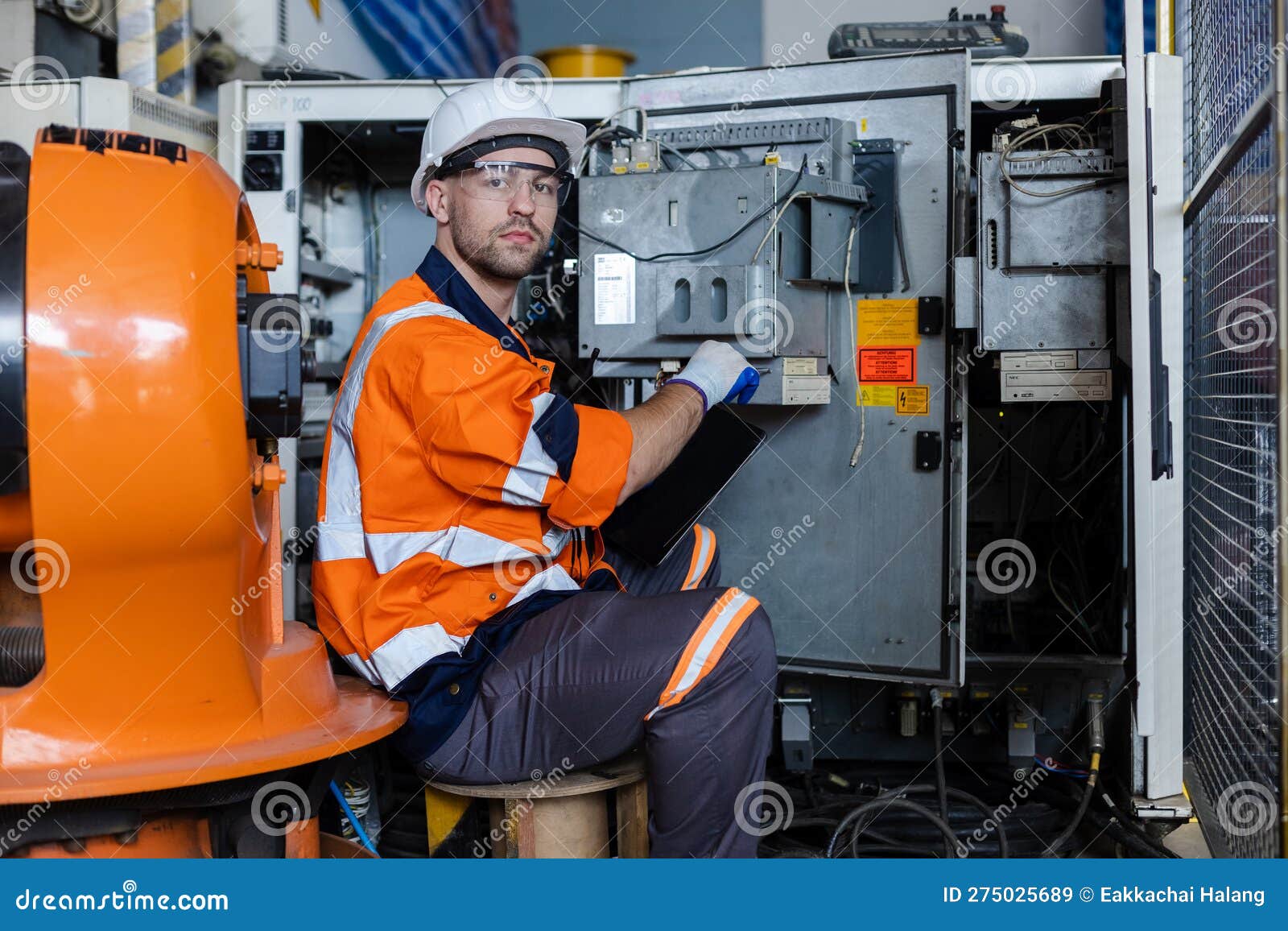 Factory Engineers Wear Uniform and Helmet are Checking Quality System ...