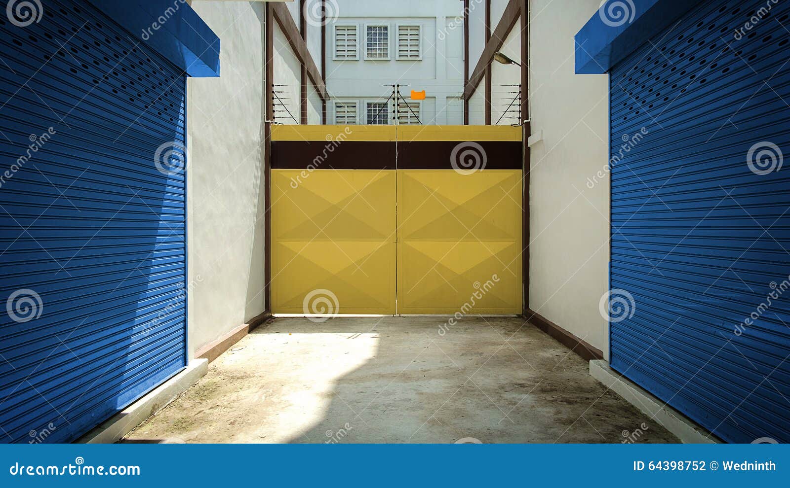 Factory Entrance with Yellow Shutter,blue Rolling Door Stock Photo ...